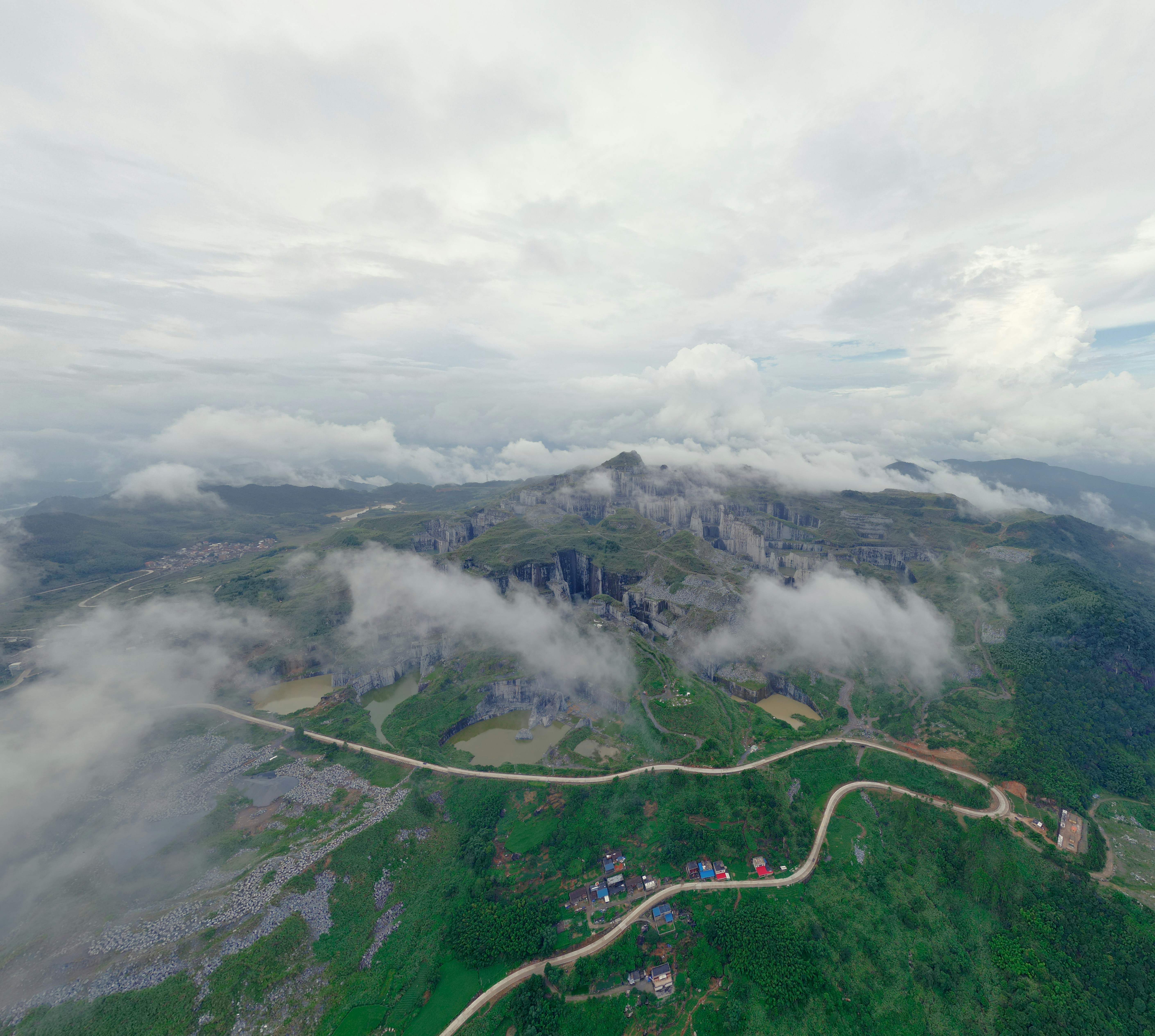 Rolling Highlands and Cloud-Wrapped Ridge