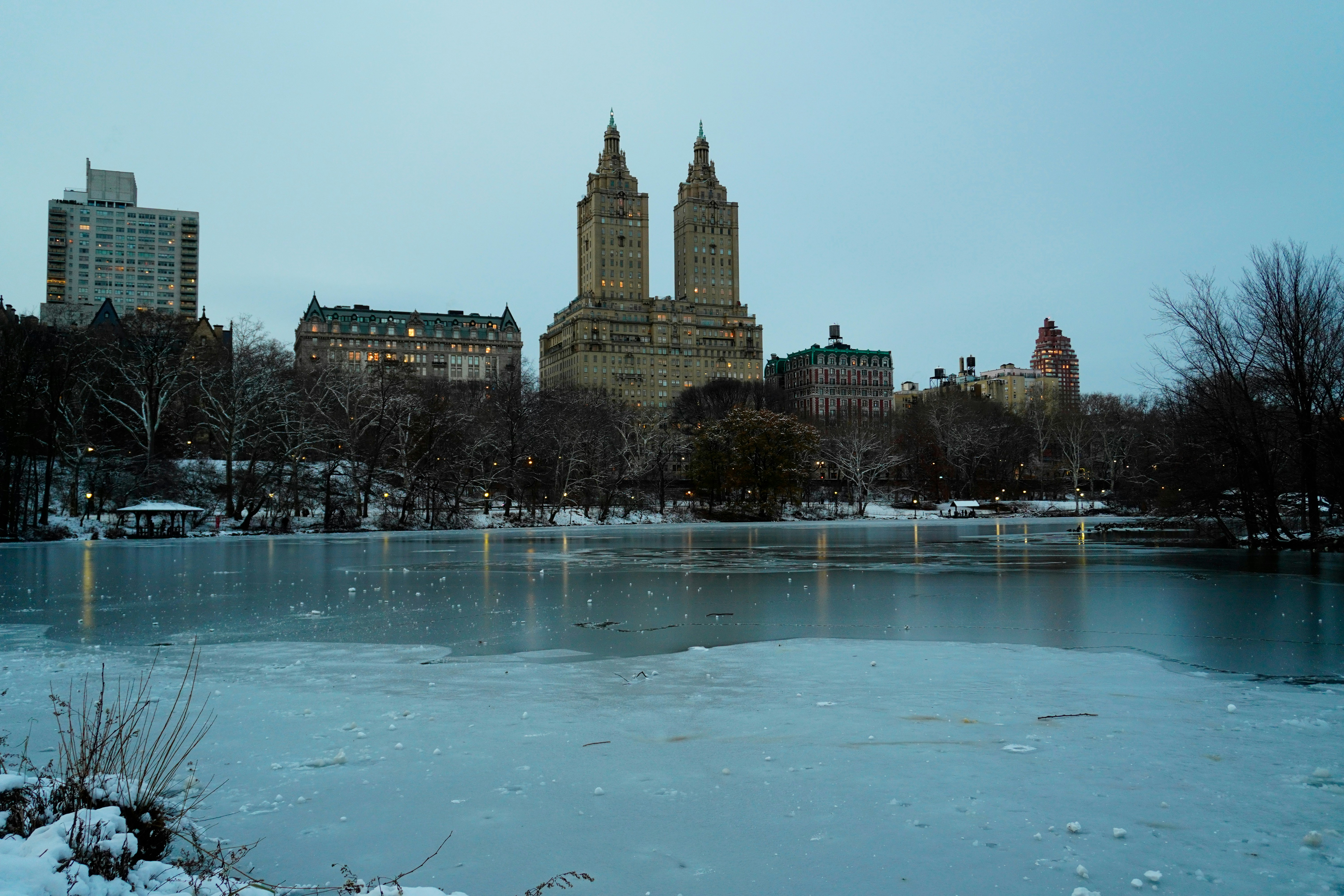 Twin Towers Silhouettes Over a Quiet Frozen Lake