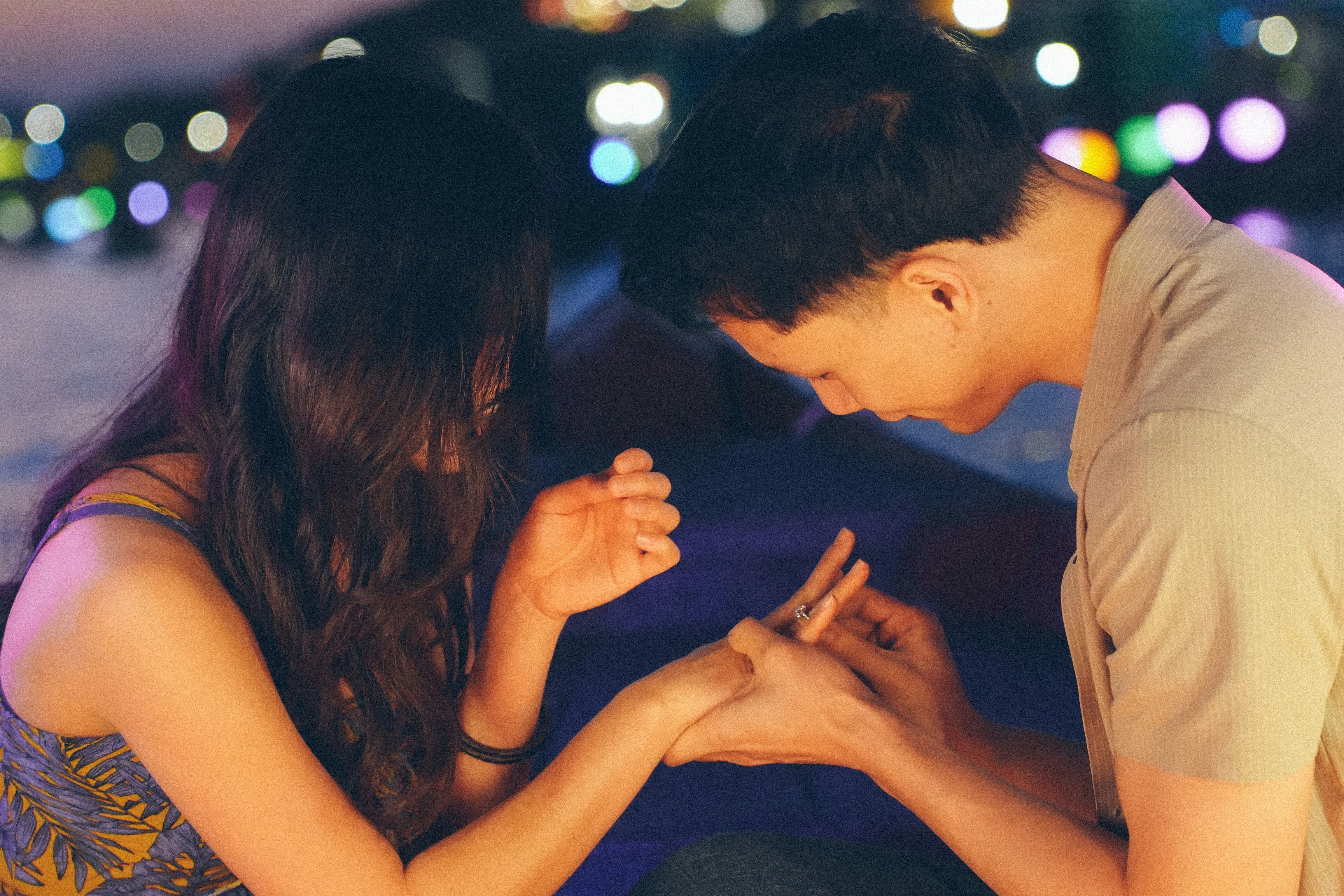 Night Lights and a Shared Ring: A Quiet Moment Between Lovers