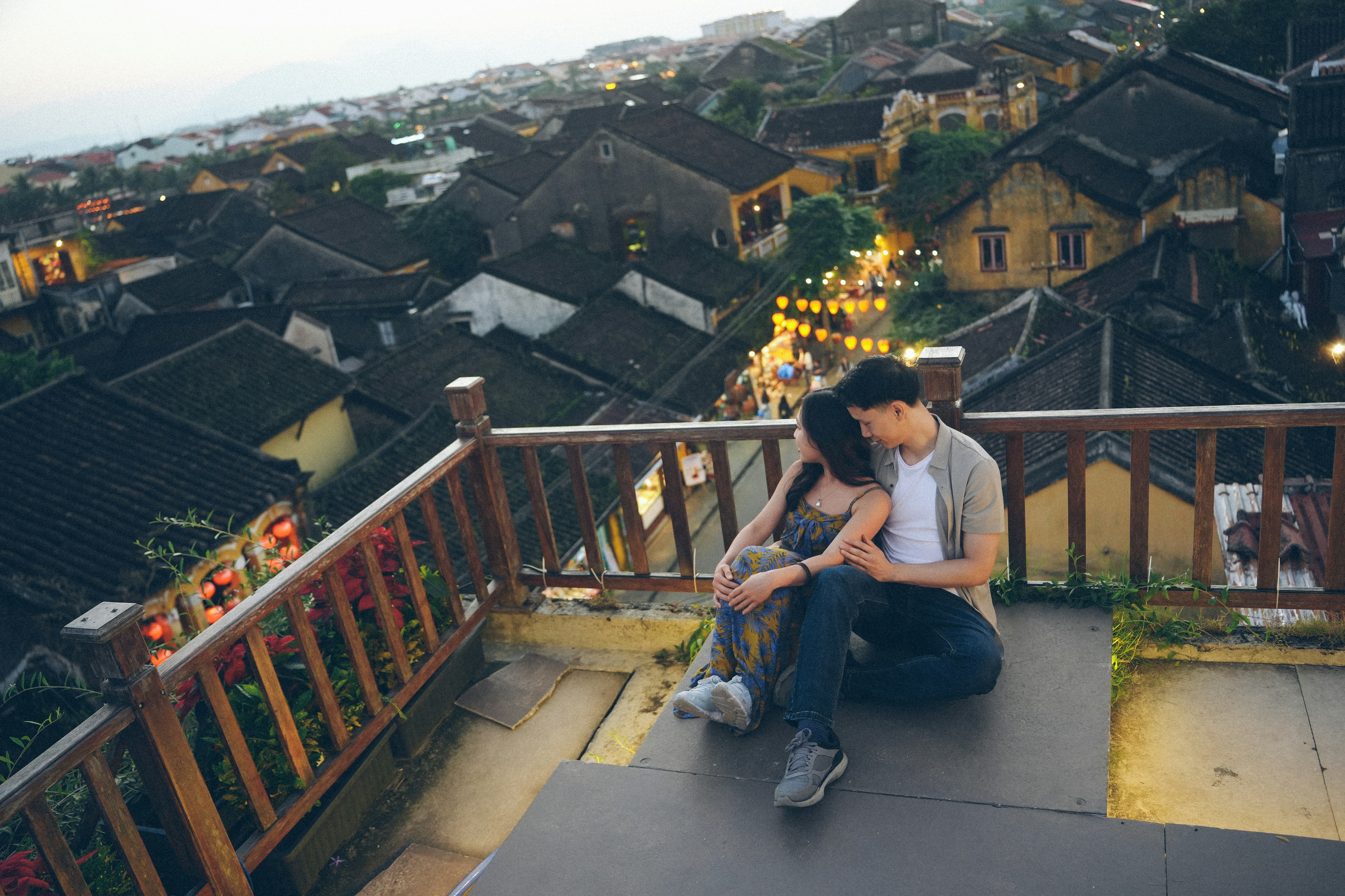  Rooftop Embrace Over a Lantern-Soft City
