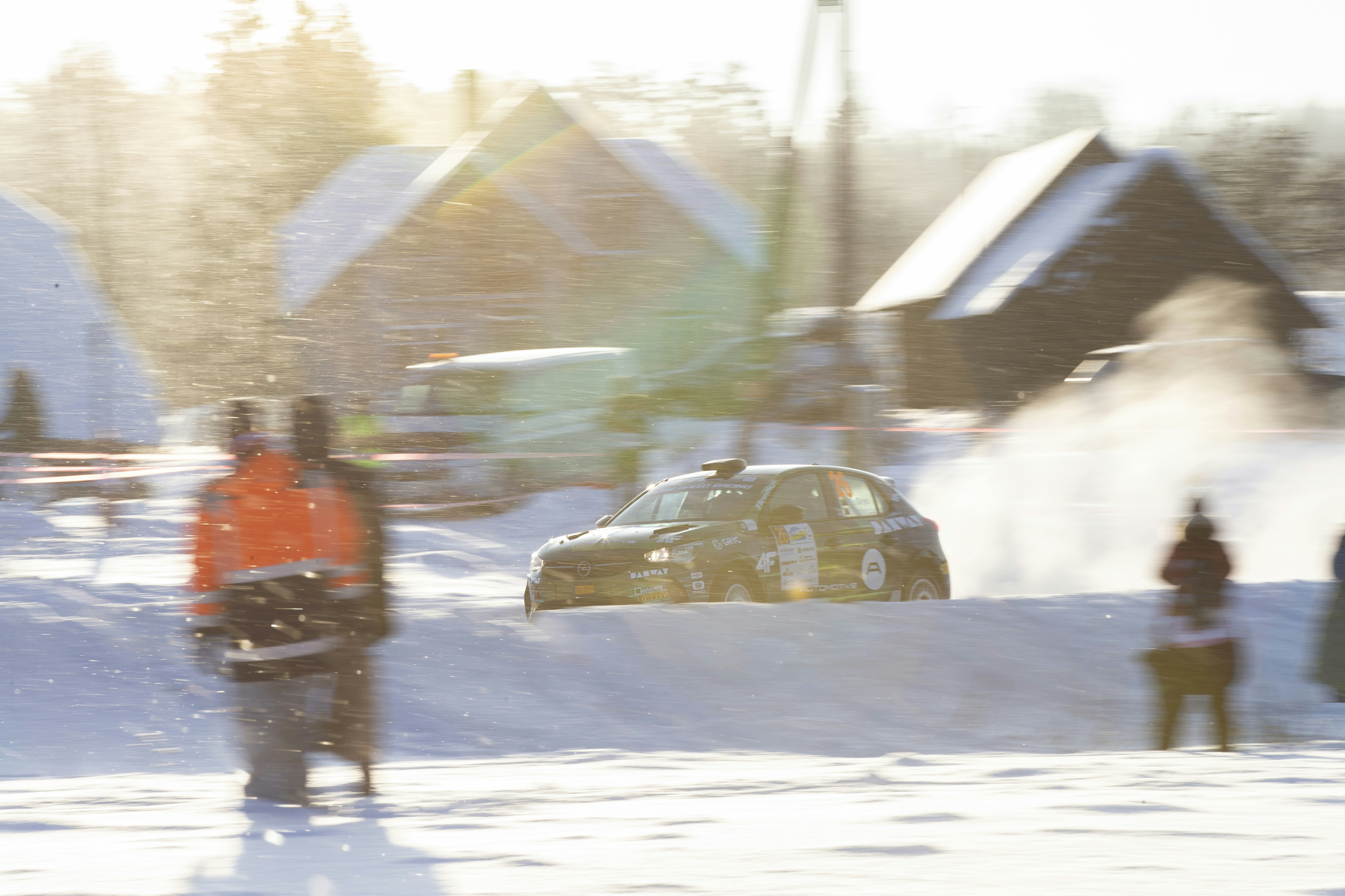 Snowbound Rally: Car in Motion on a Frosty Track