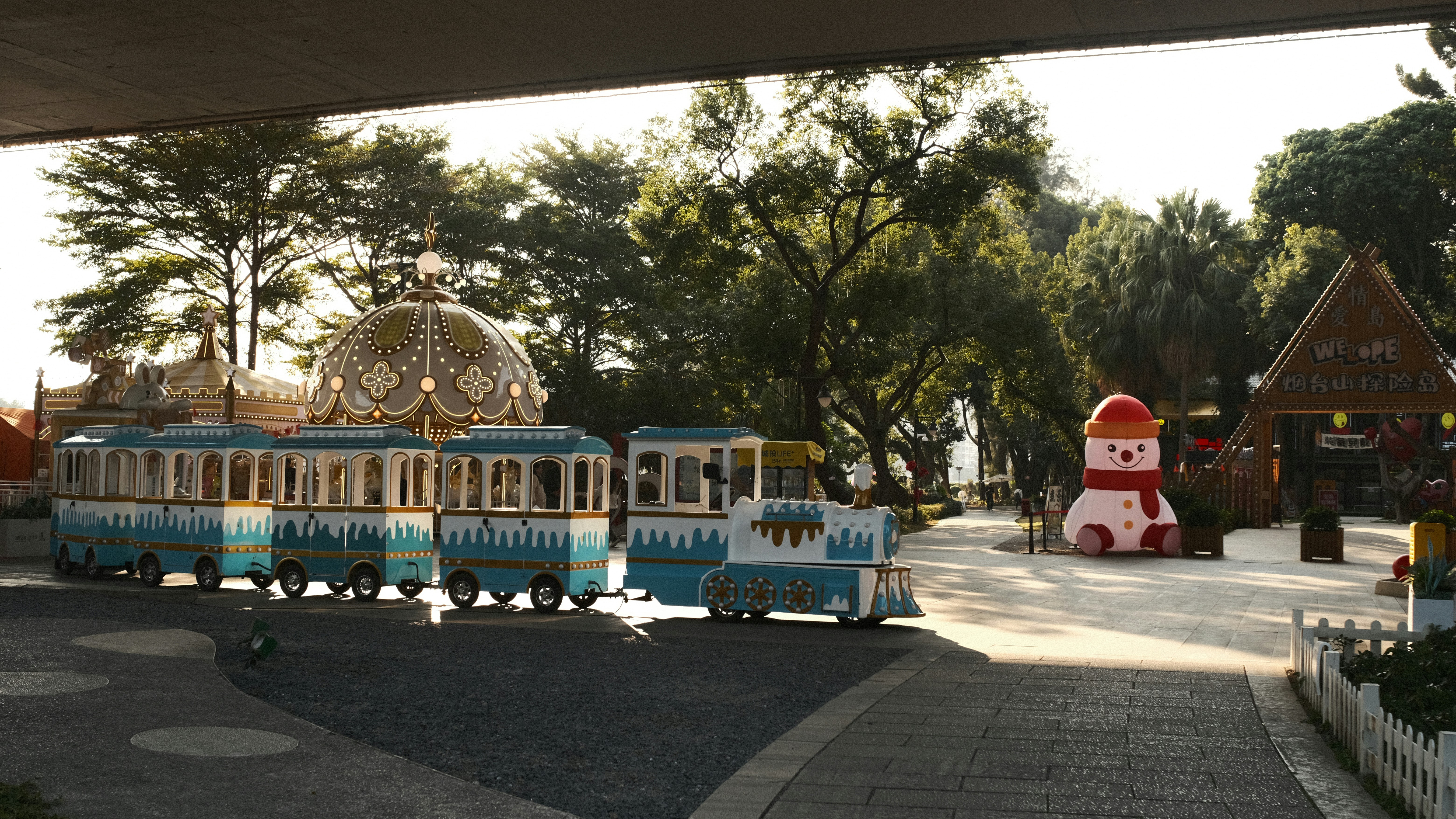 Toy Train Parade under a Playground Canopy