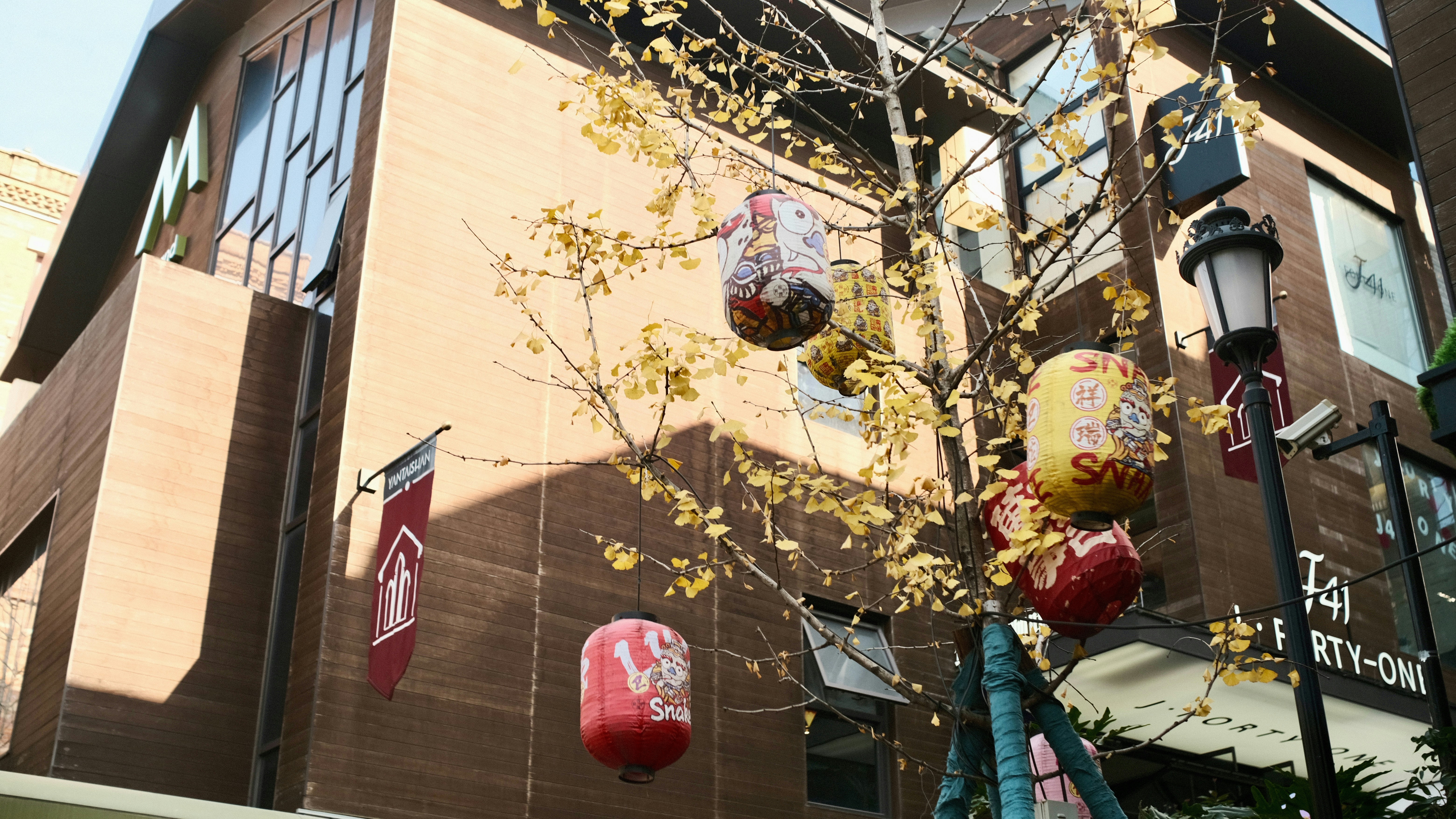 Lantern Parade Over Brass and Brick
