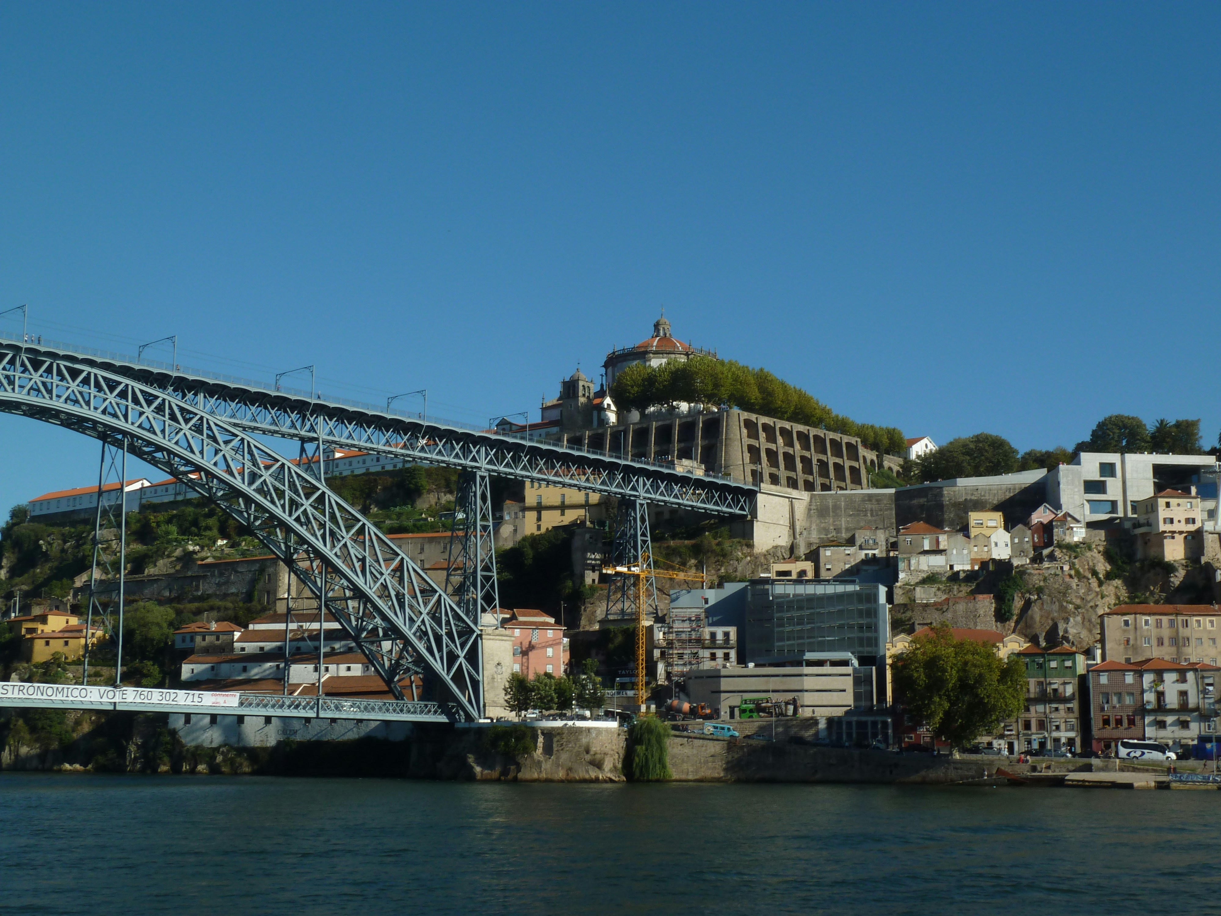 Curved Harbor Bridge Carves Through a Hillside Port