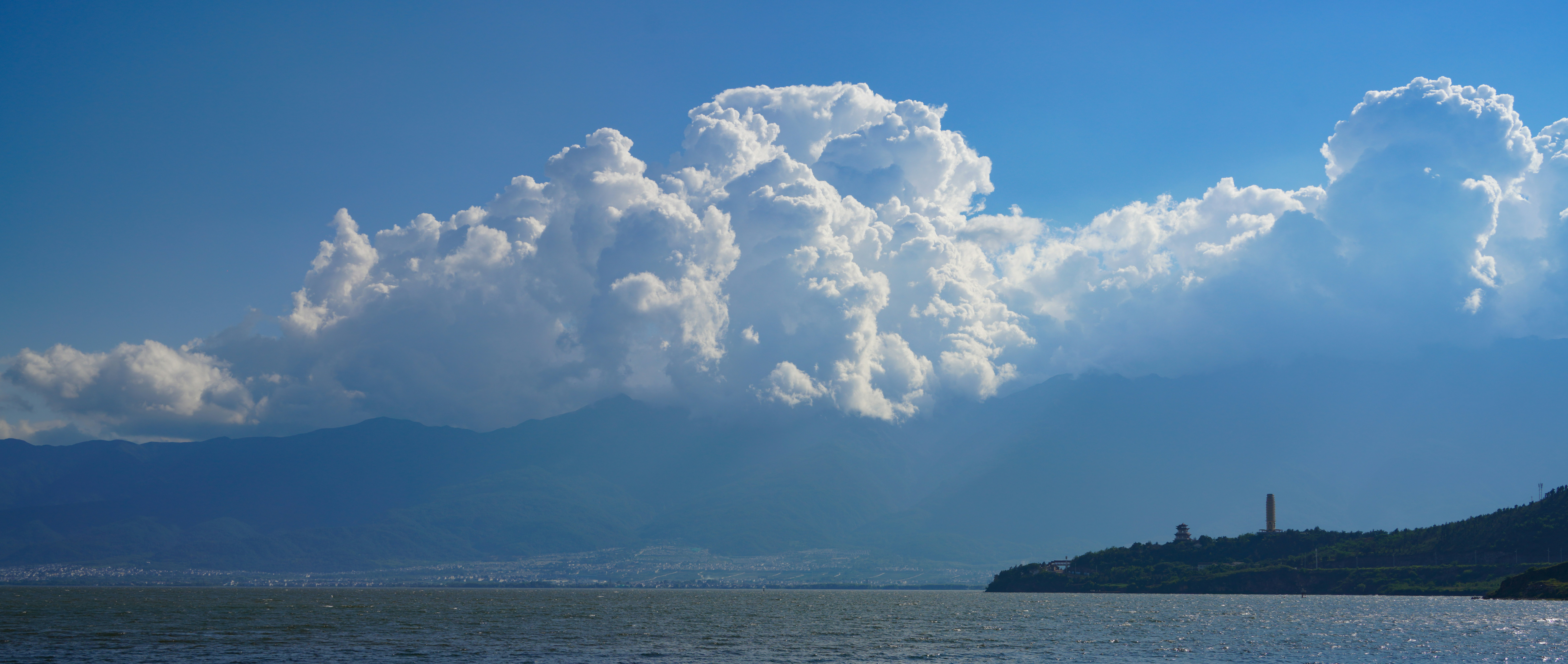 Clouds Over the Quiet Shore: A Coastal Vista