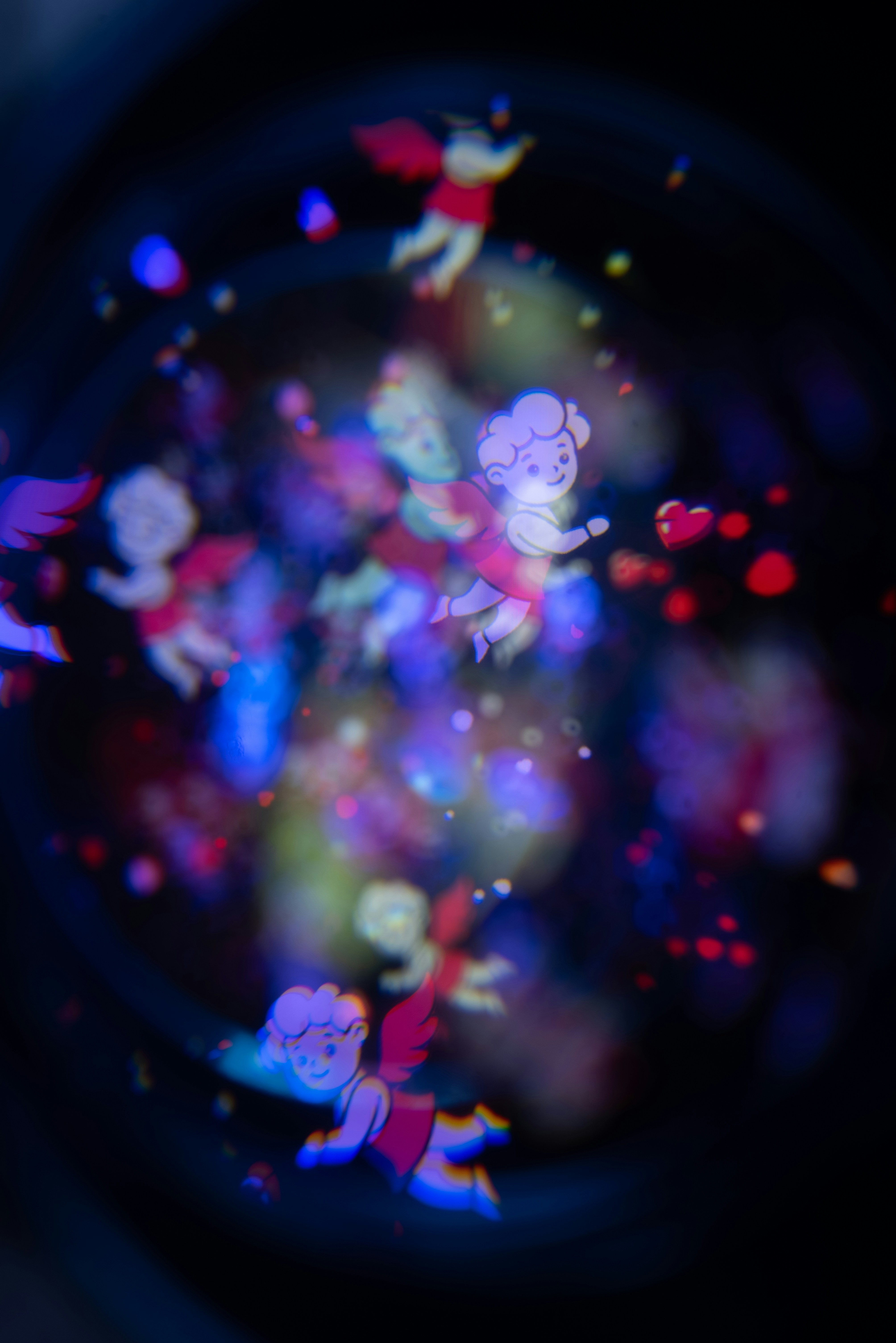 Floating Charms: Neon Cherubs within a Kaleidoscopic Lens