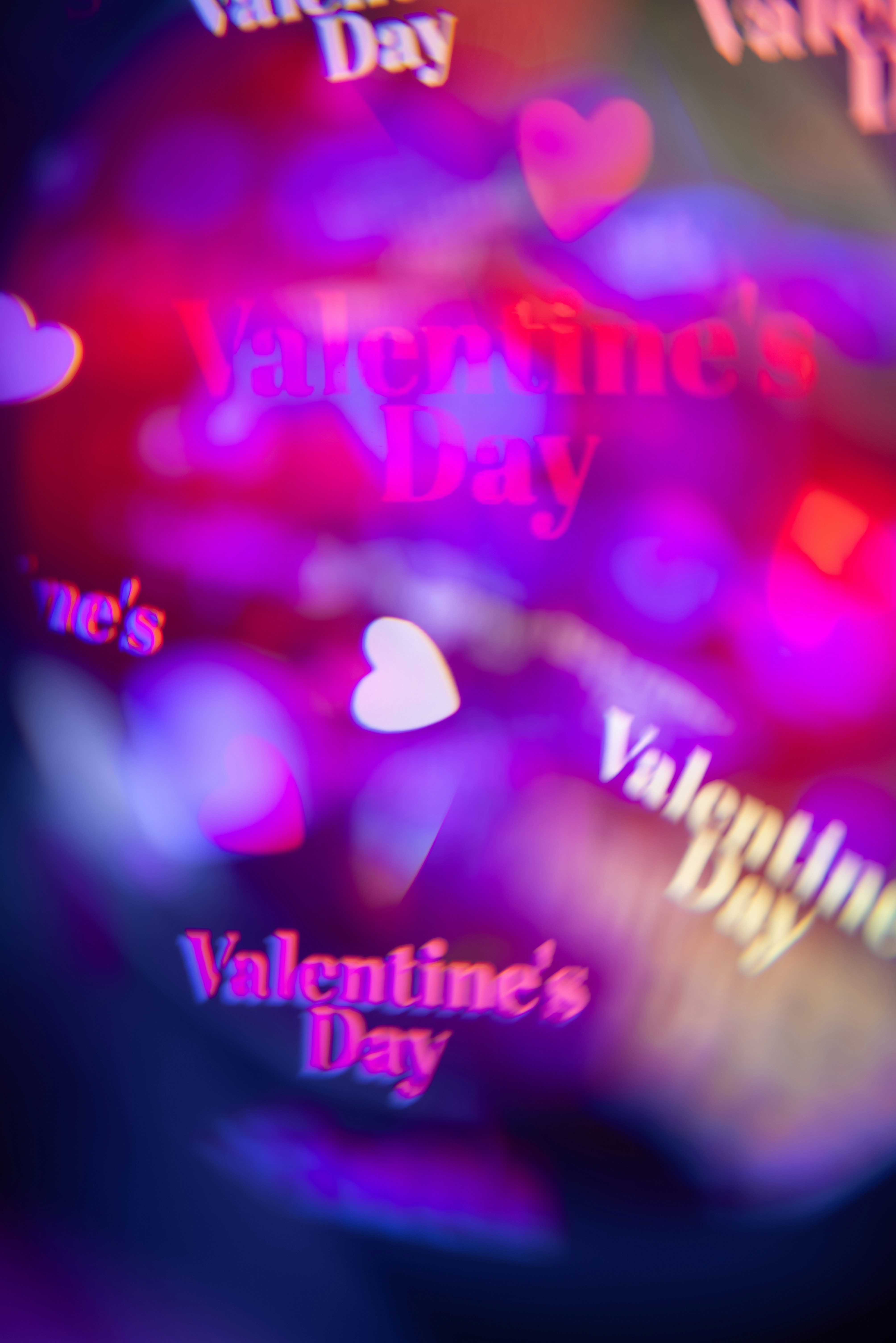 Valentine's Day Neon Blur: Heart Shapes in Prism-Soft Bokeh
