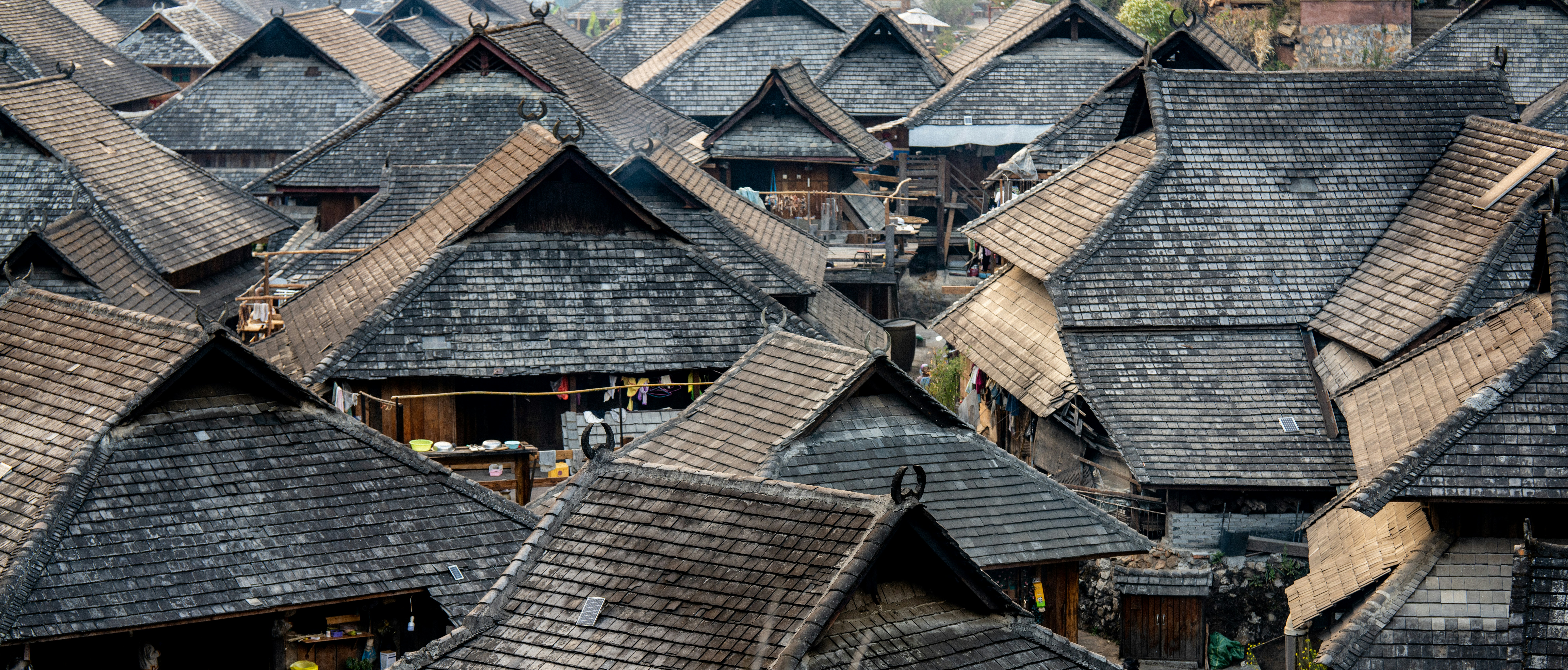 Dense village with many traditional thatched roofs. photo – Free ...