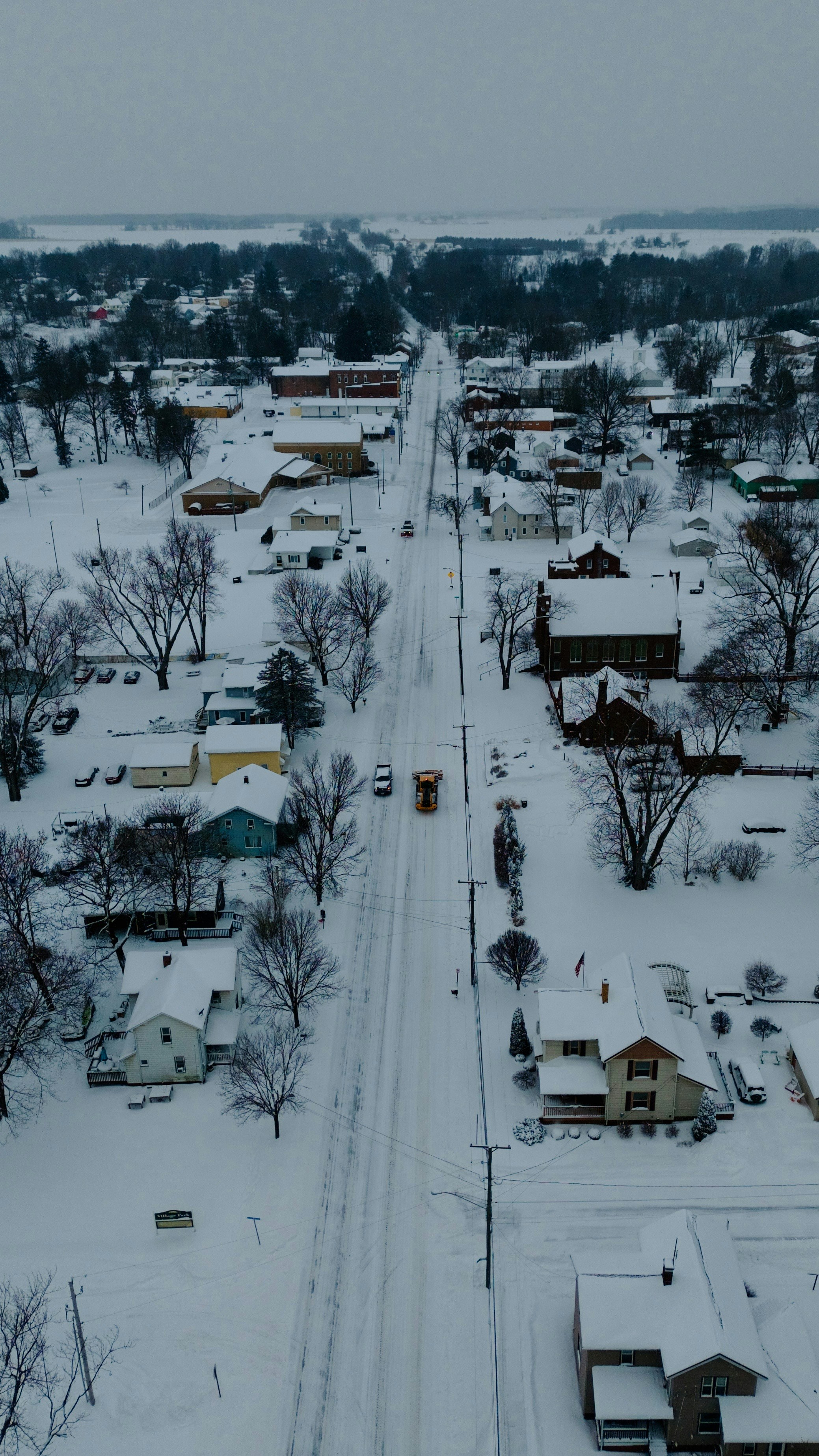 Snowbound Main Street: Aerial Avenues in Quiet Winter Town