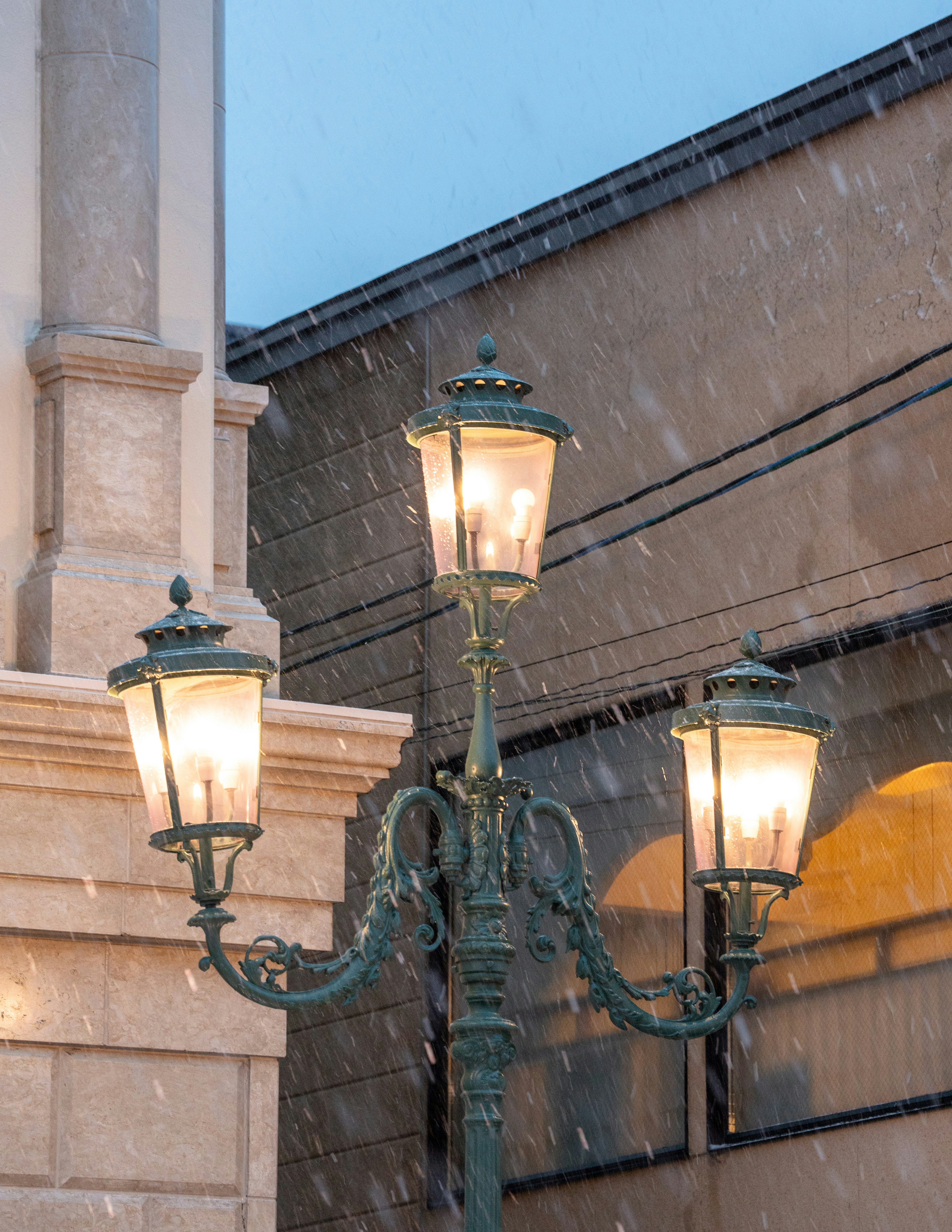 Gaslit Arches in the Snow: A Lantern Crowd