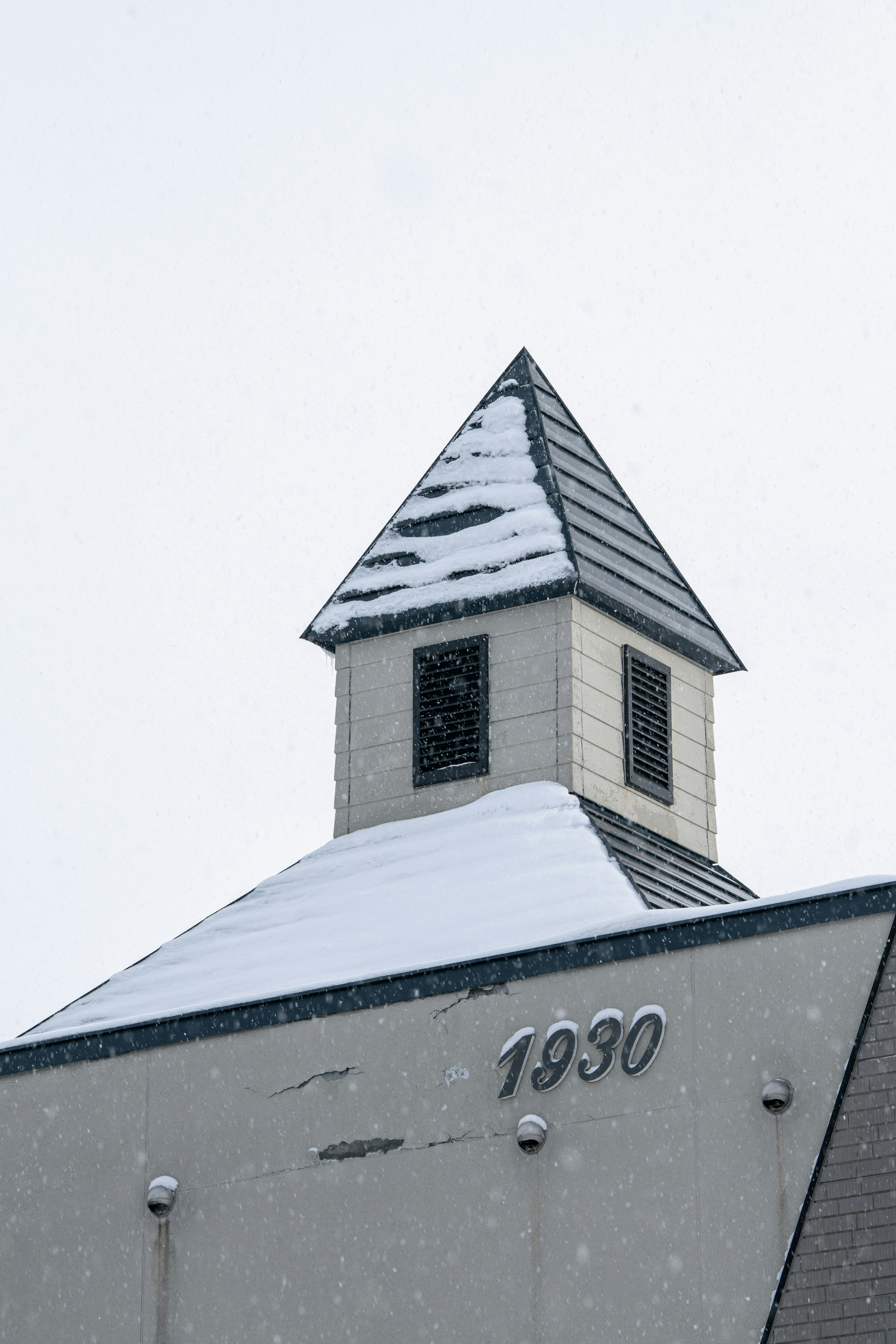 Snow-Capped Cupola Silhouette Over a Quiet Facade