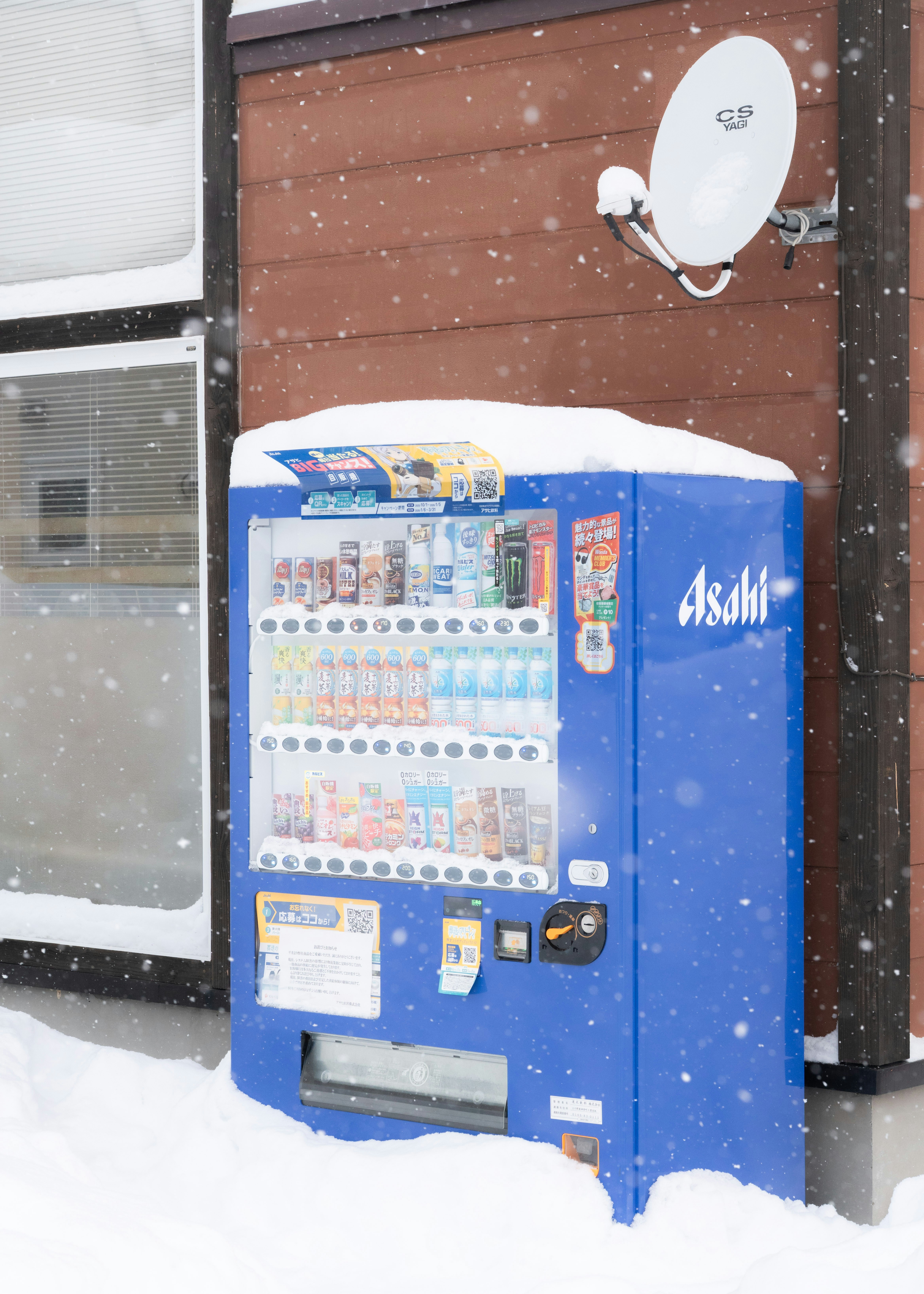 A blue asahi vending machine covered in snow. photo – Free Japan Image ...