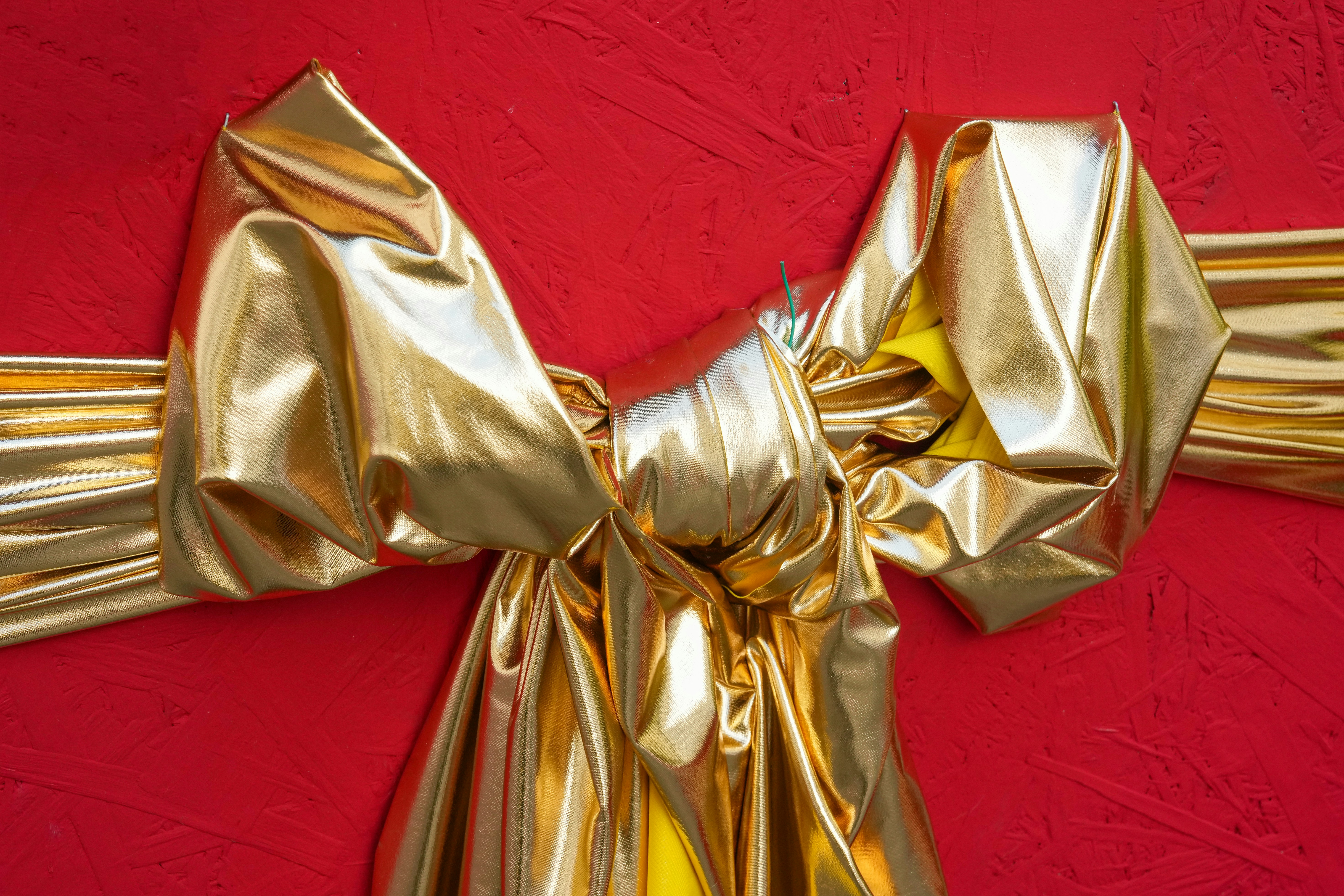 Golden Bow of Tension on a Scarlet Backdrop