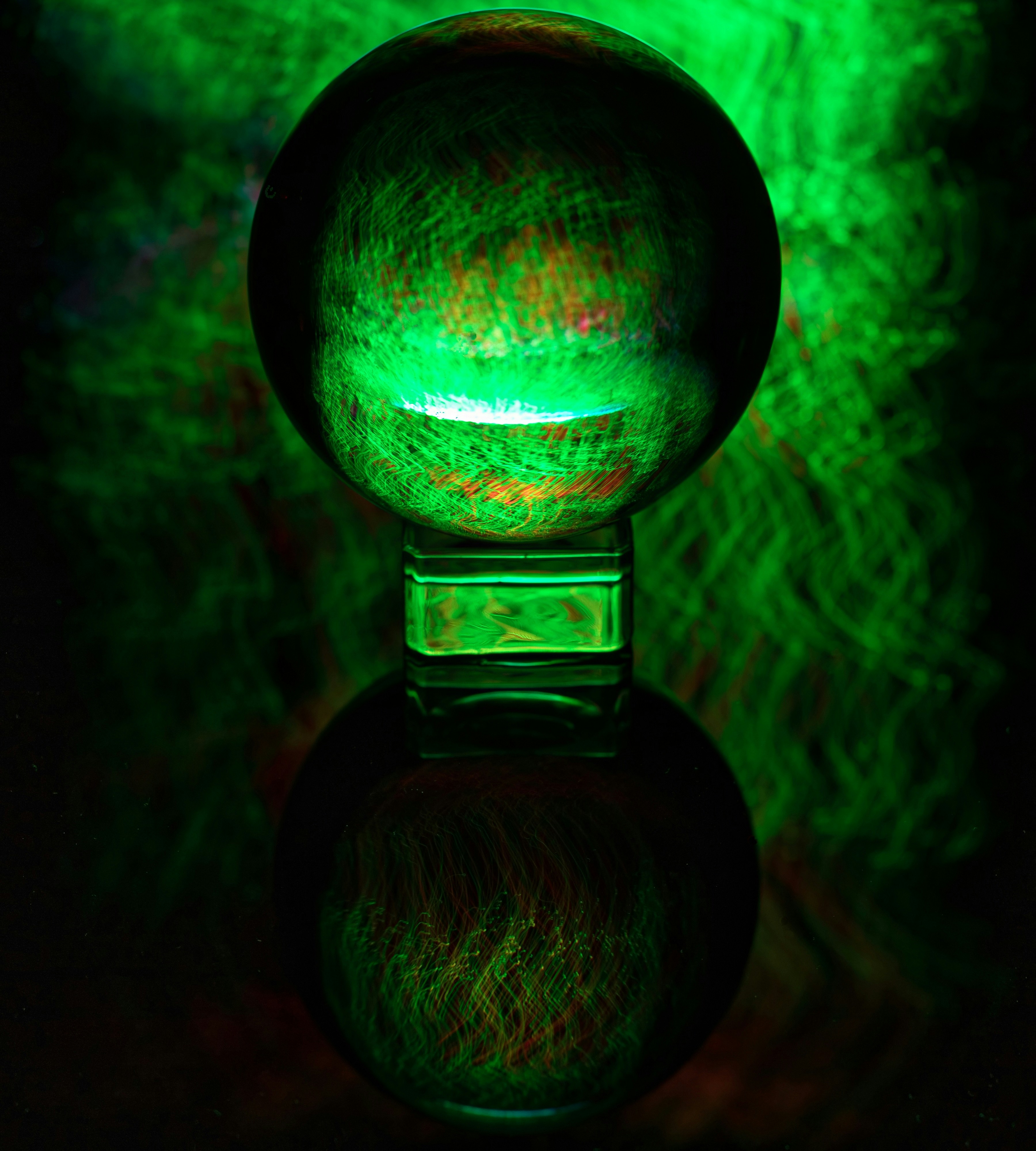 Emerald Sphere on a Reflective Stage