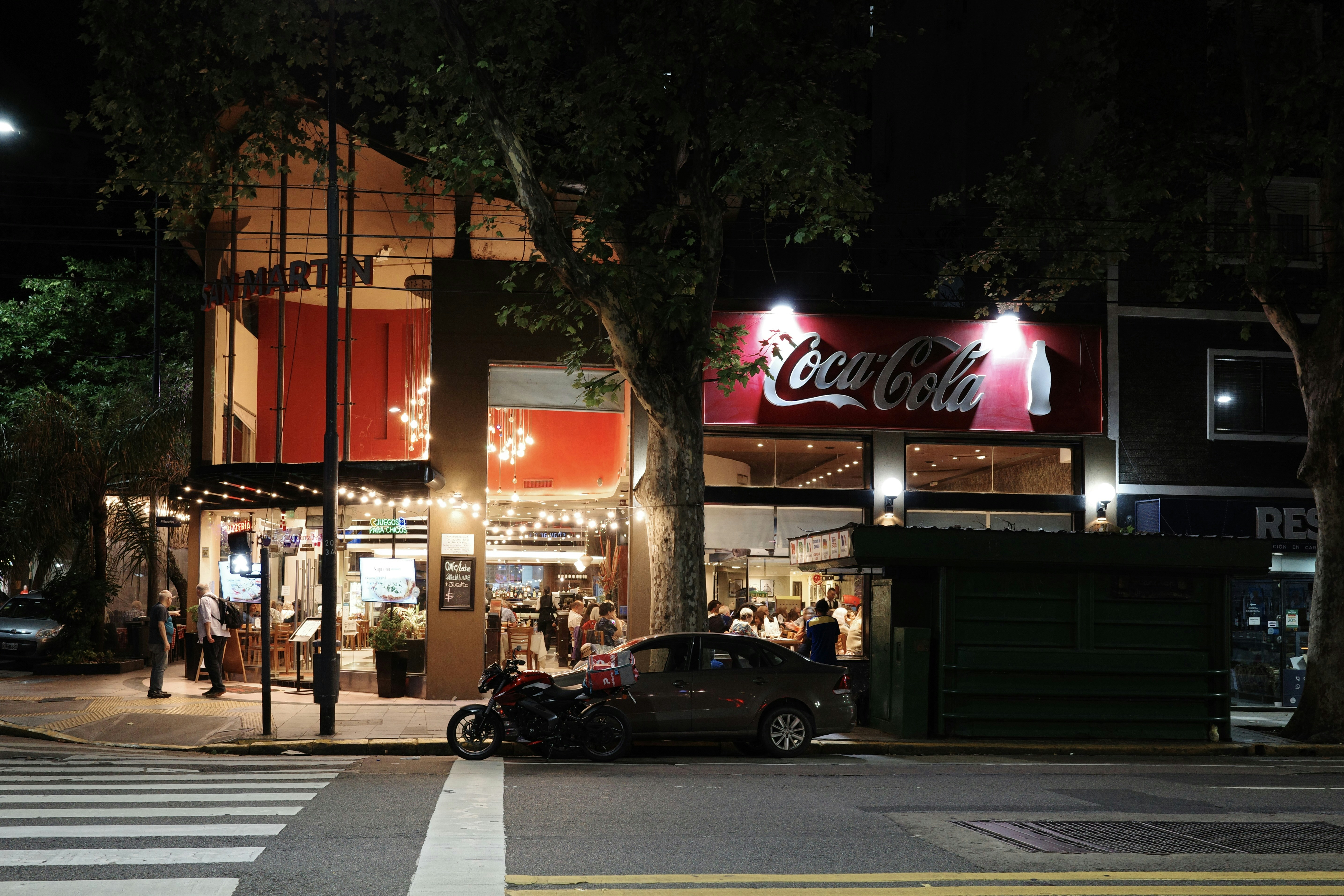 Coca-Cola Glow Across a Quiet Night Street