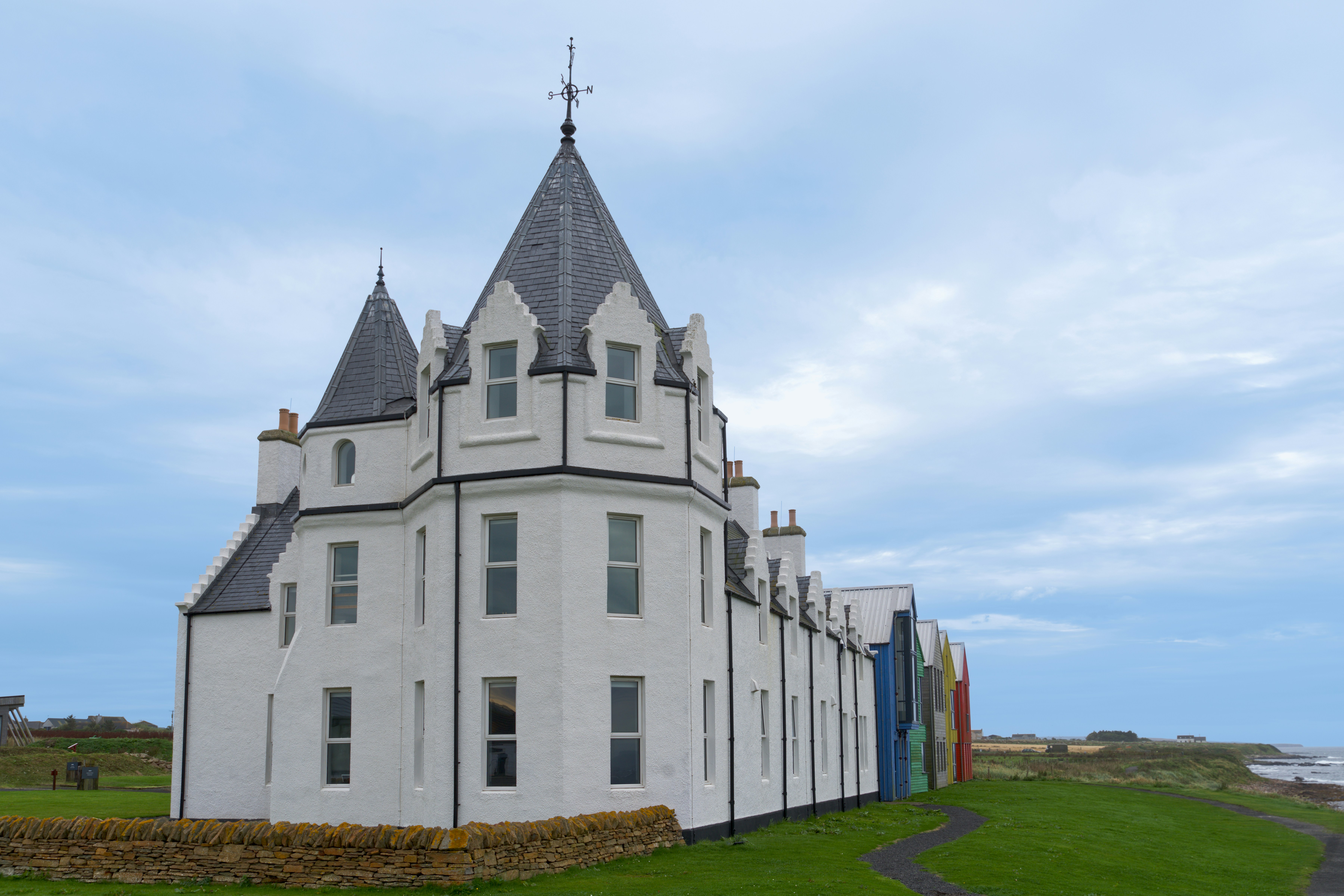 Castle by the Sea: A White Fortress Under a Wide North Sea Sky