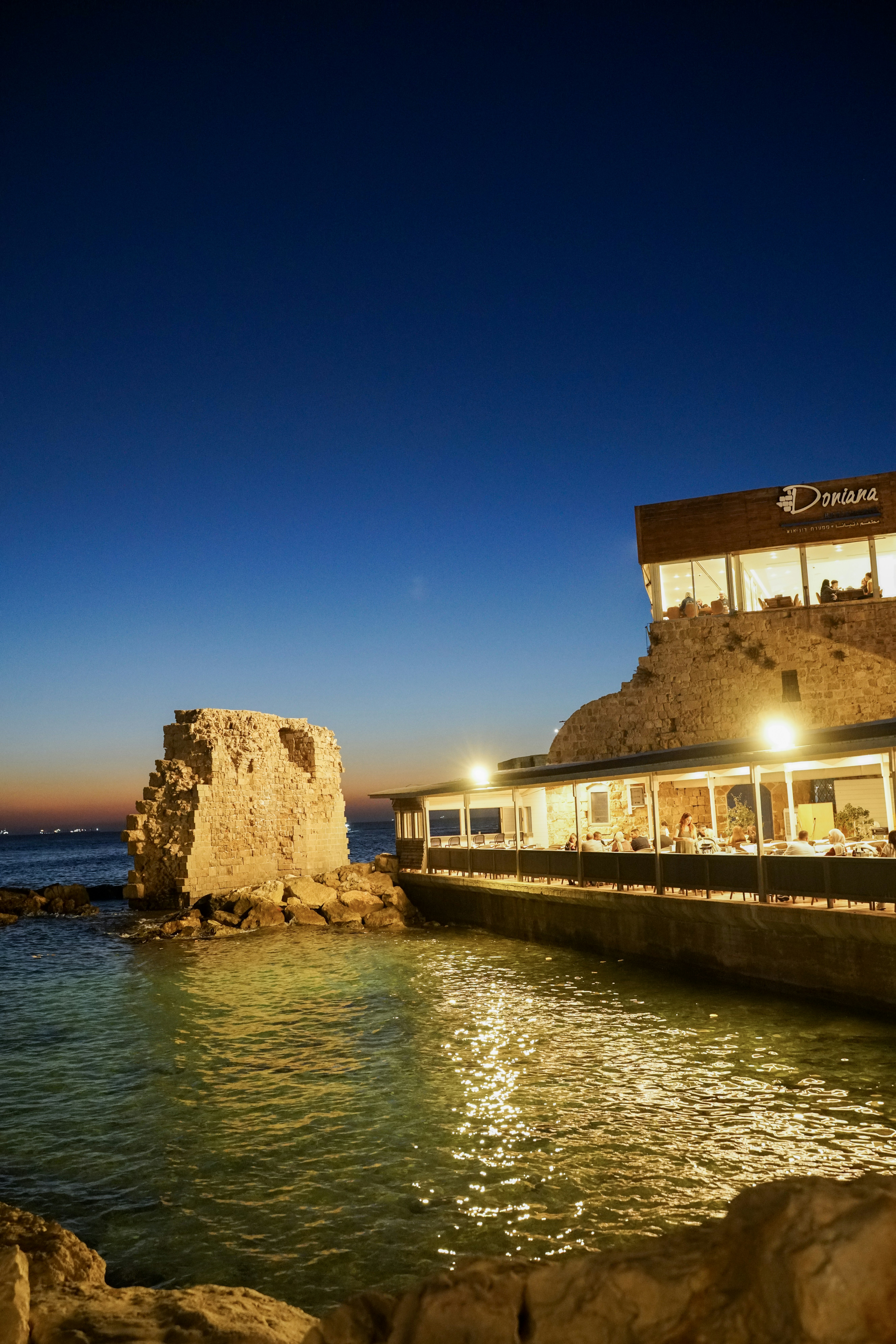 Sunlit Elixirs by the Sea: A Terrace Overlooking the Quiet Tide