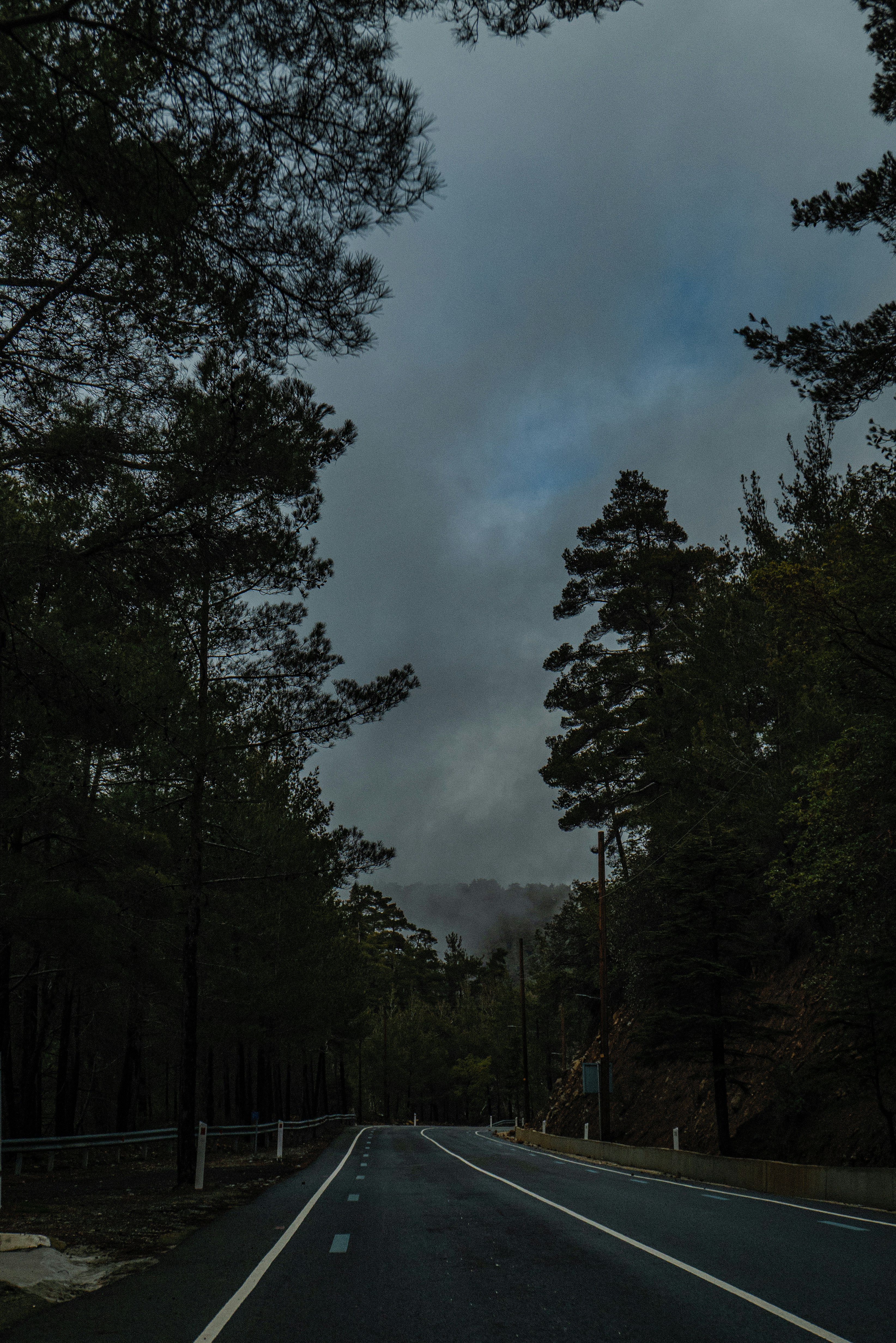 Snowy-Shadowed Highway Beneath a Brooding Sky