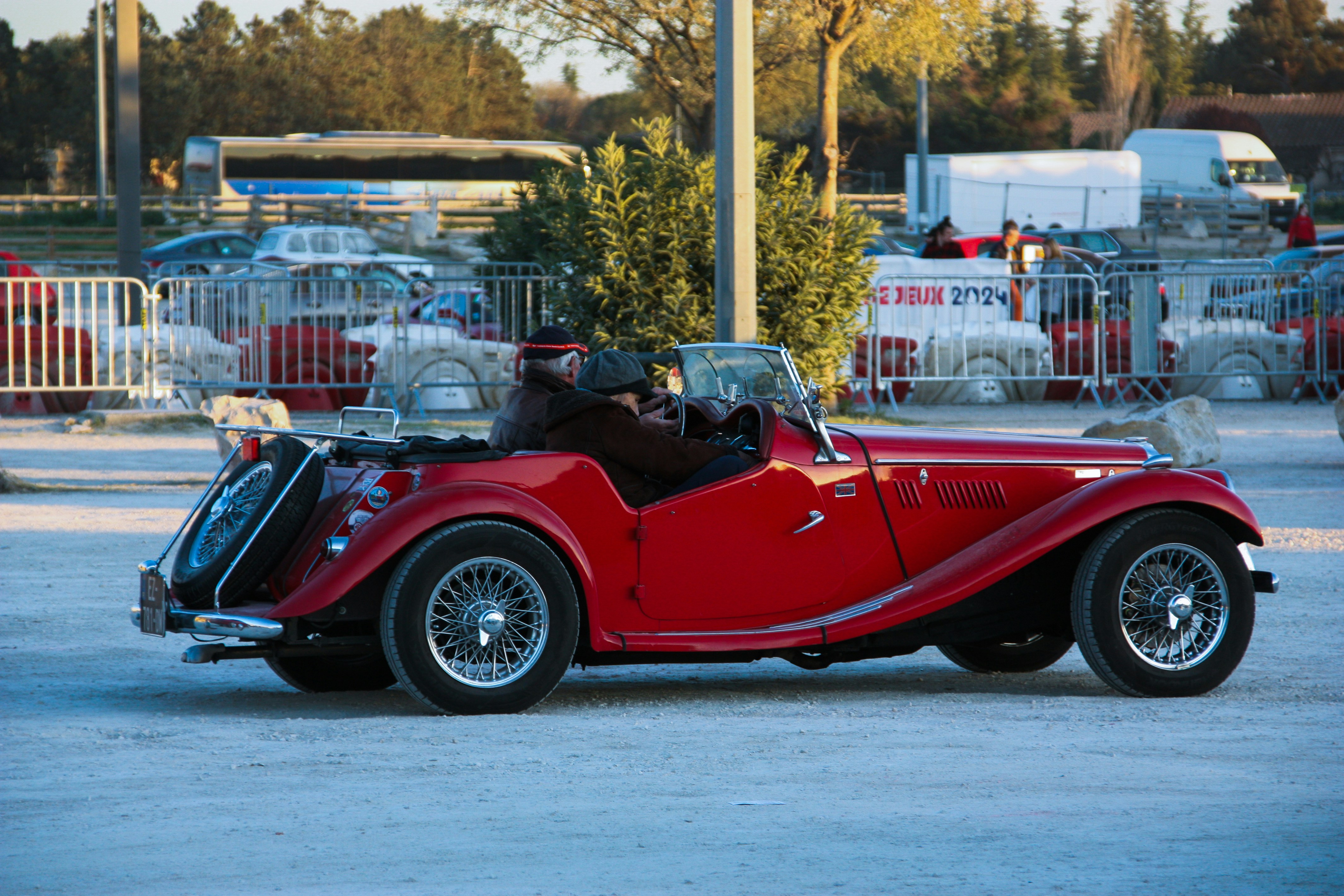 Red Vintage Convertible Rides Across a Frozen Lot