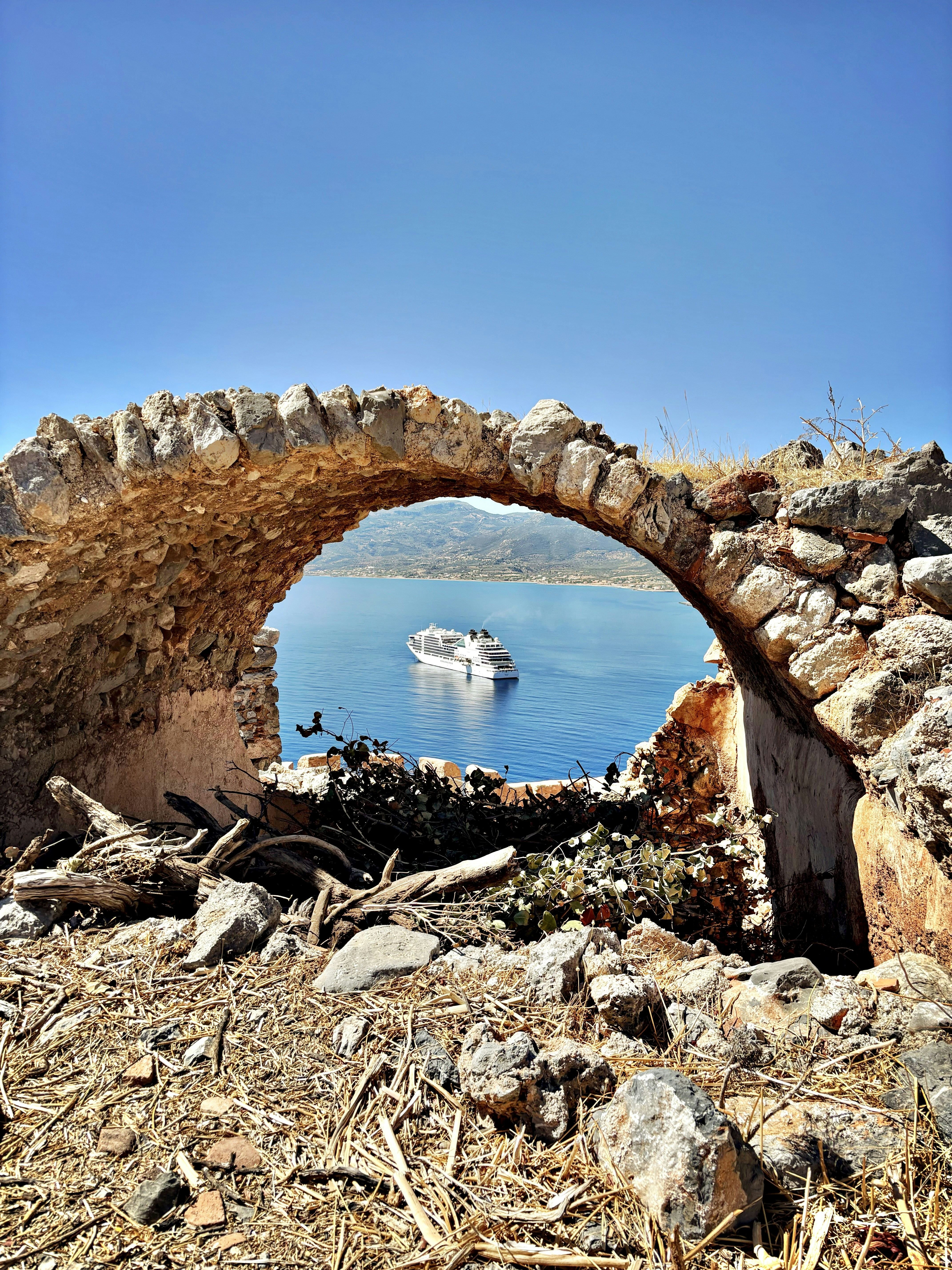 Through the Stone Ring: A Seascape View of a Docked Cruise
