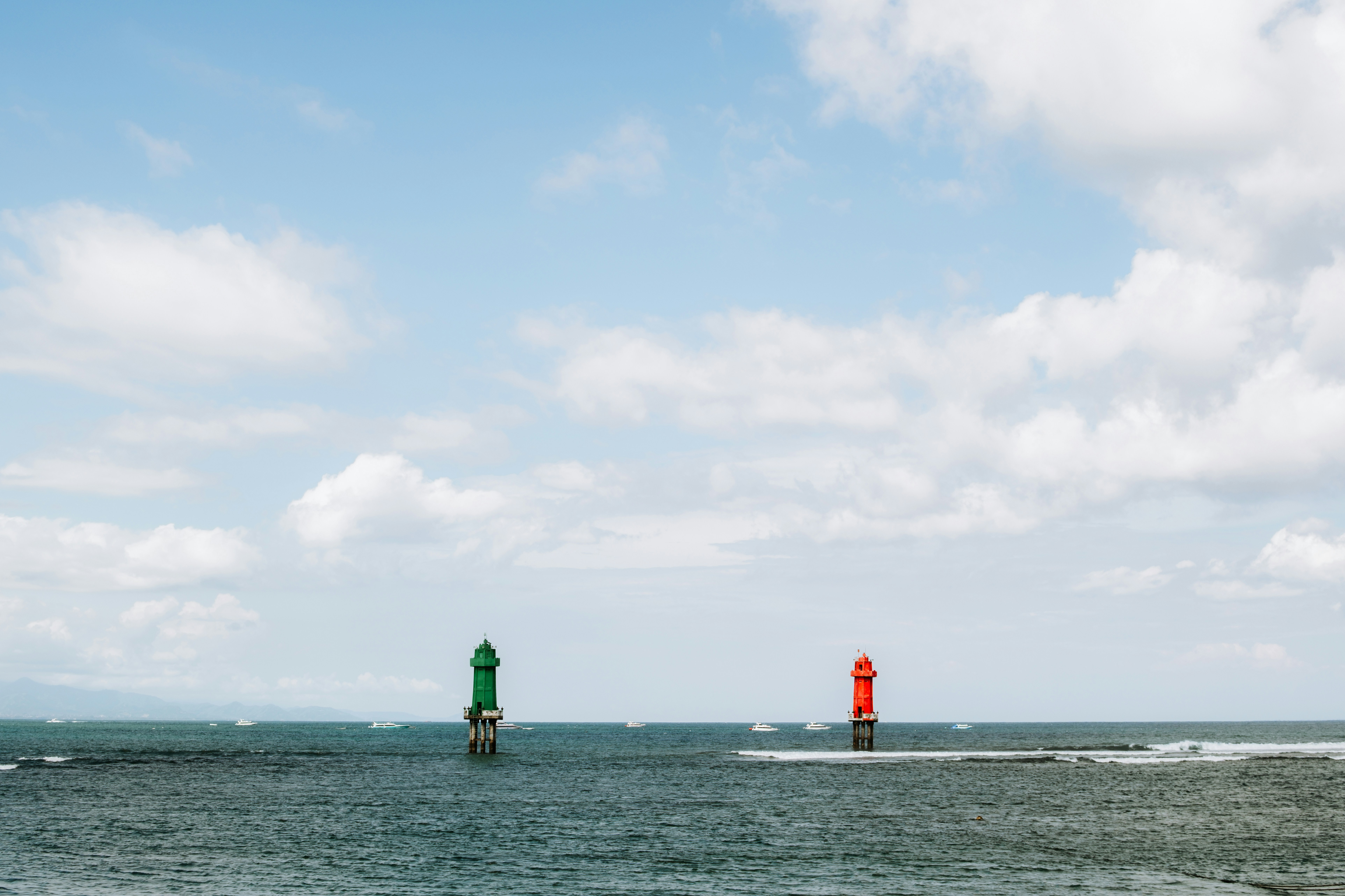 Twin Mariners: Green and Red Buoys Standing Guard at Distant Horizon