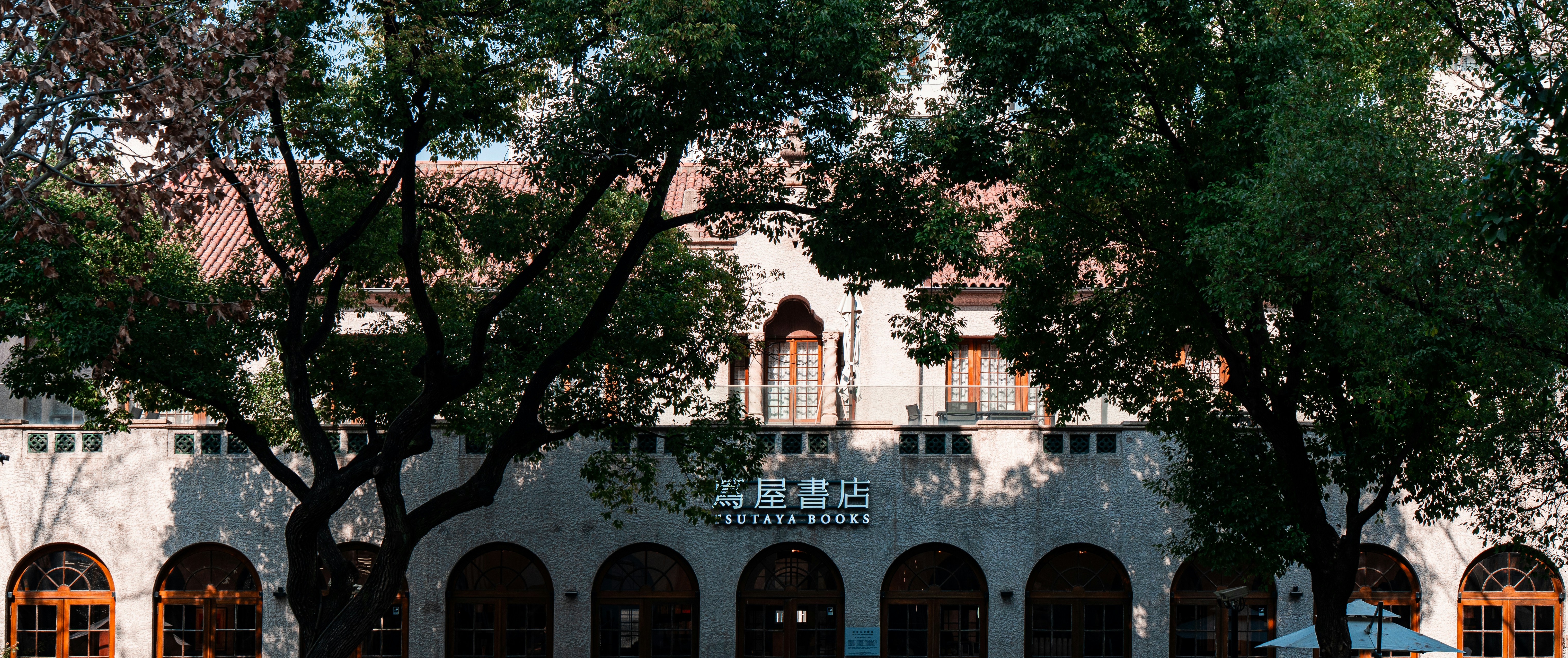 Sunlit Arcades and Towered Facade: A Quiet Street Portrait