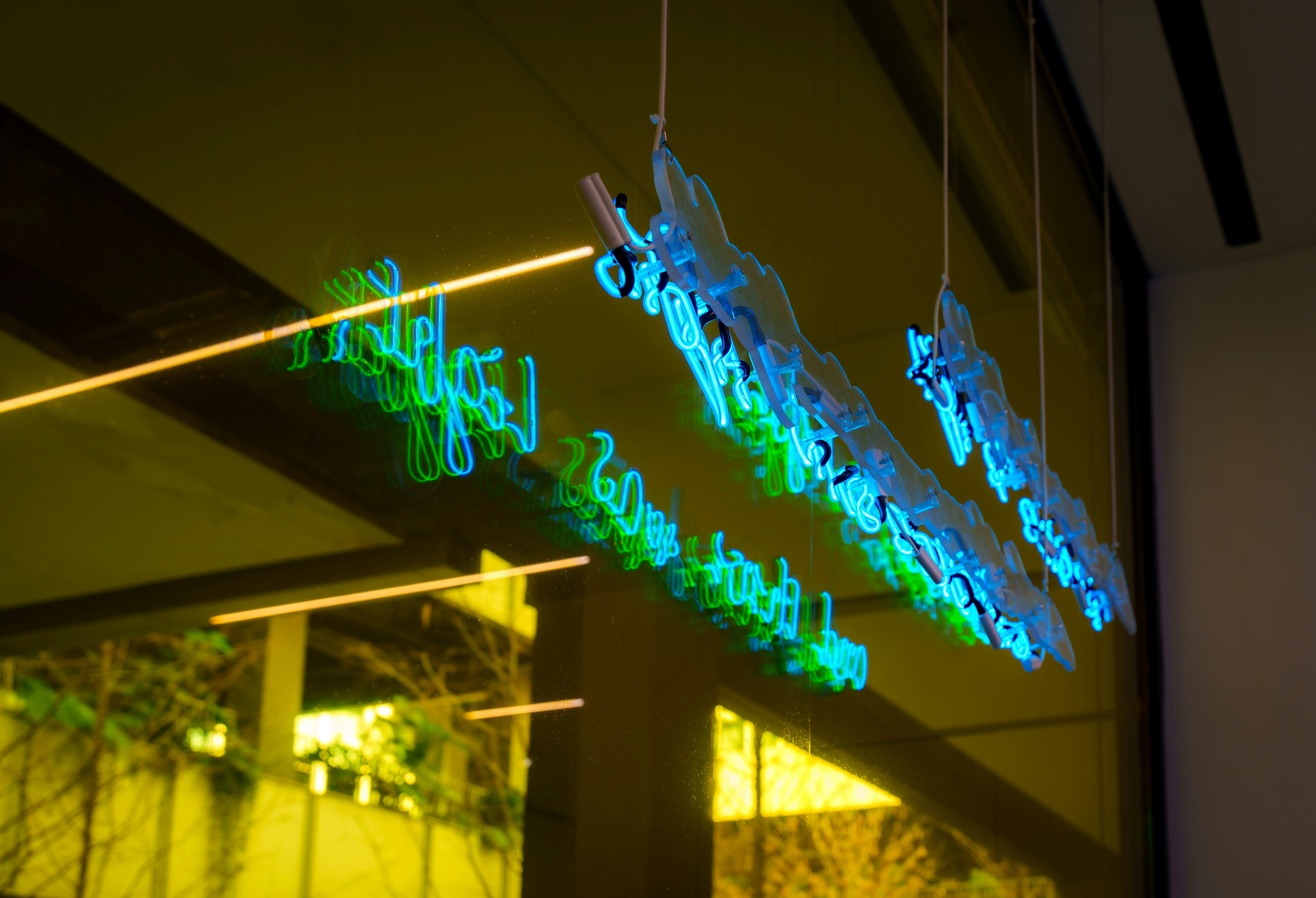 Neon Script in Motion: a Night Window of Glowing Glyphs