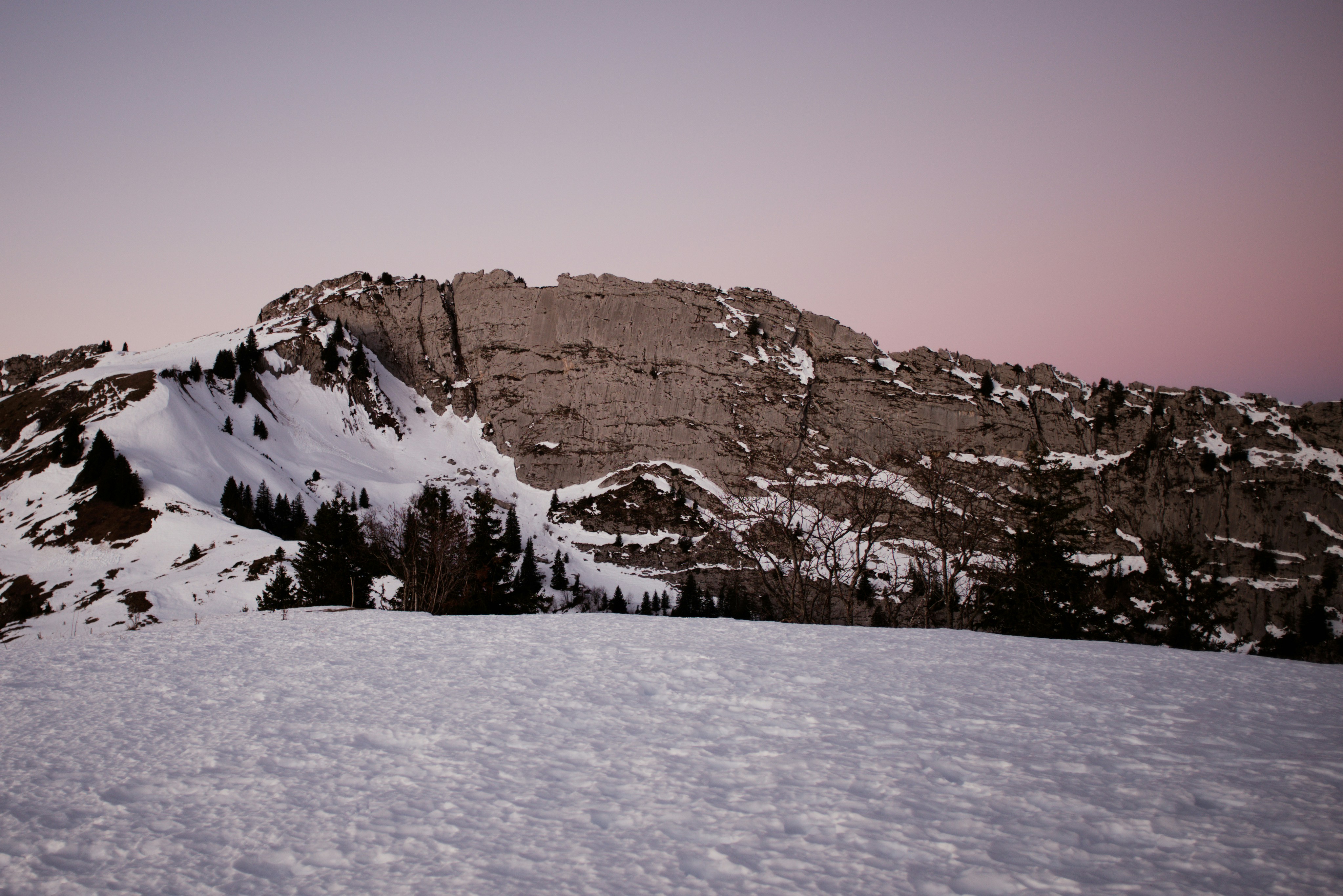 Snowbound Ridge Under a Pink Evening Sky