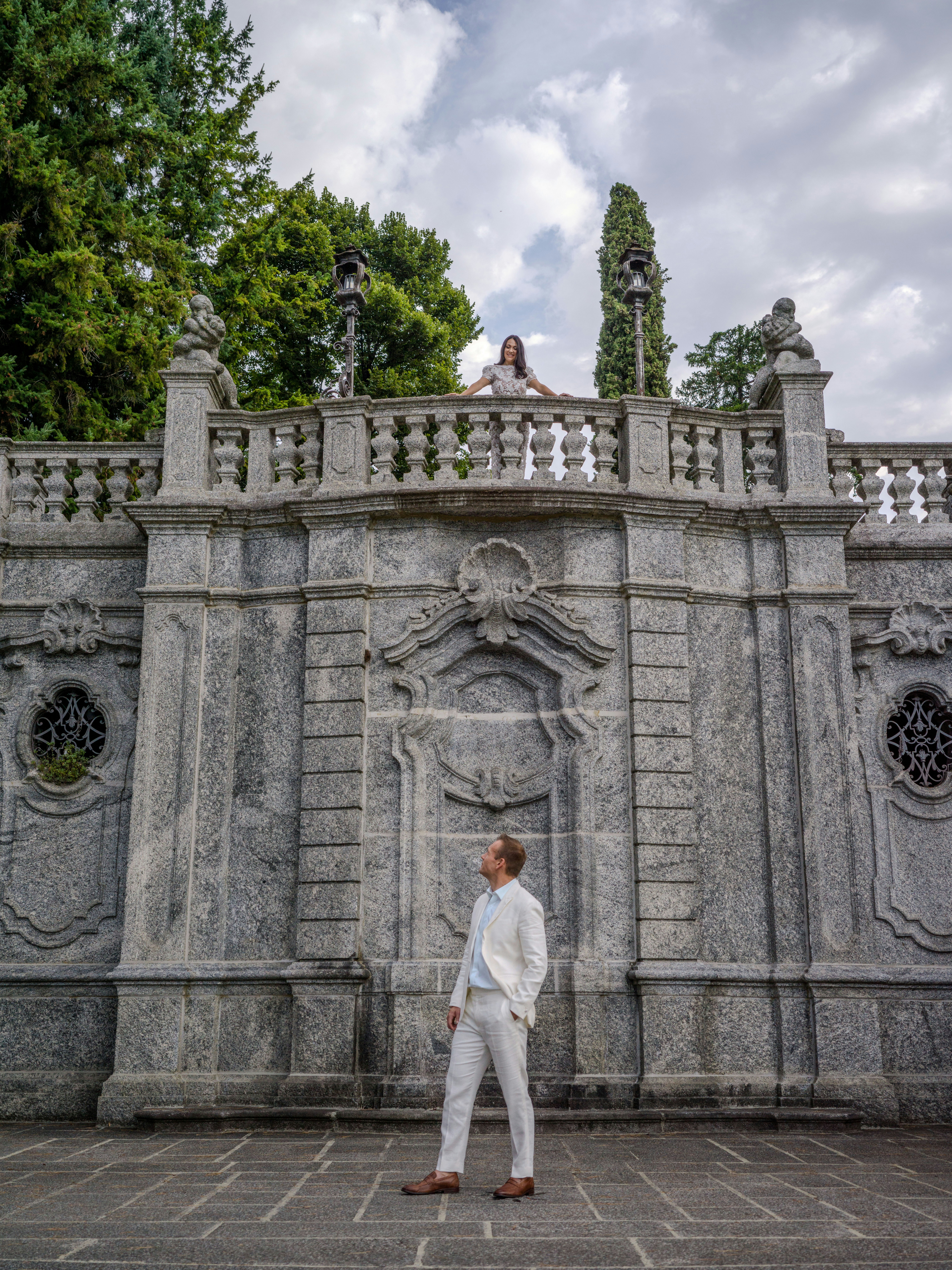 Portraits Above the Terrace: A Robed Gentleman and Gaze from the Balcony