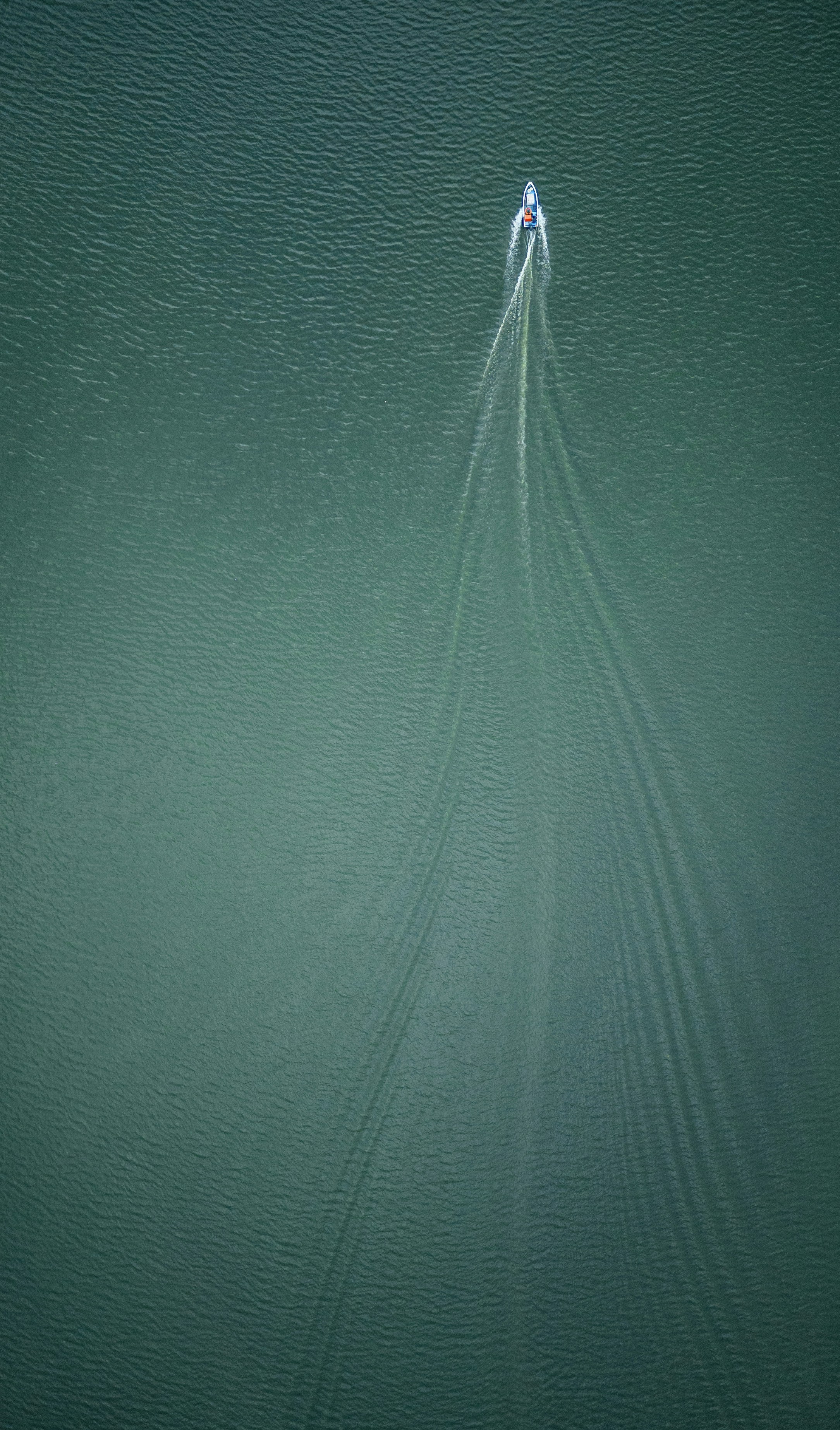 Vessel Slice: Aerial Wake Traces in Paler Turquoise Waters