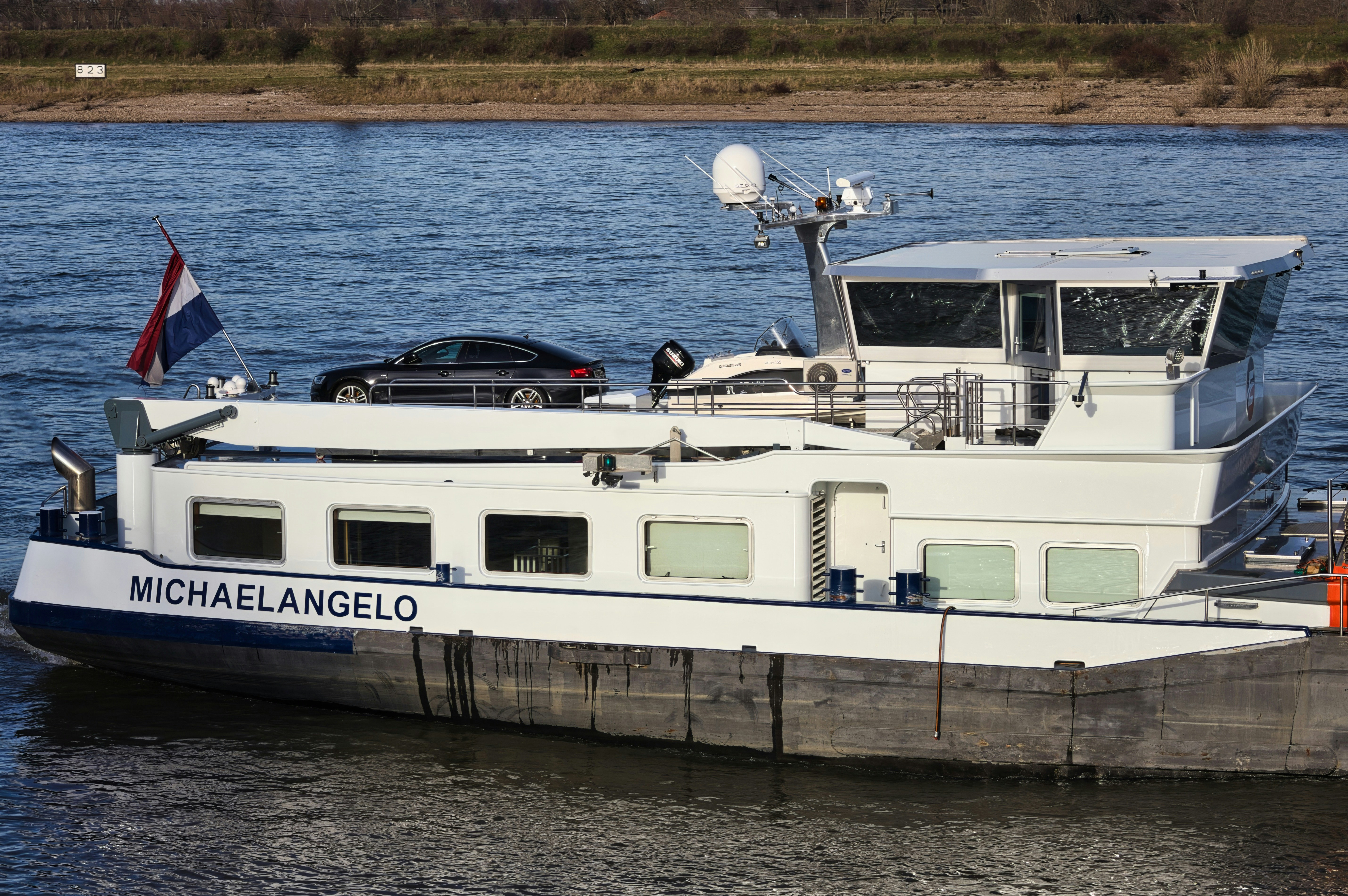 Crewed Bulk Carrier: The Houseboat Maria on Calm Waters
