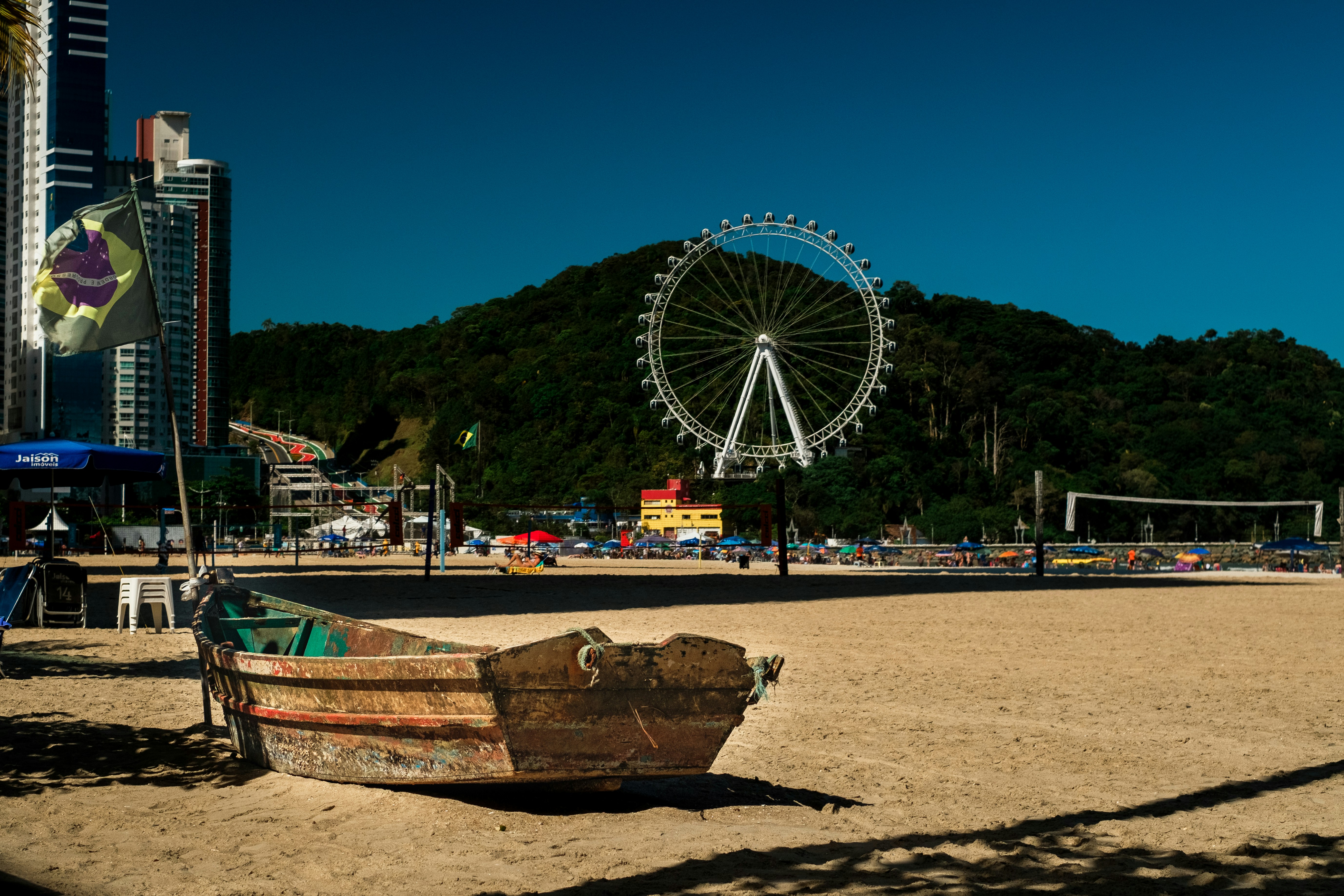 Harbor of Shadows: A Quiet Beachfront with a Giant Wheel