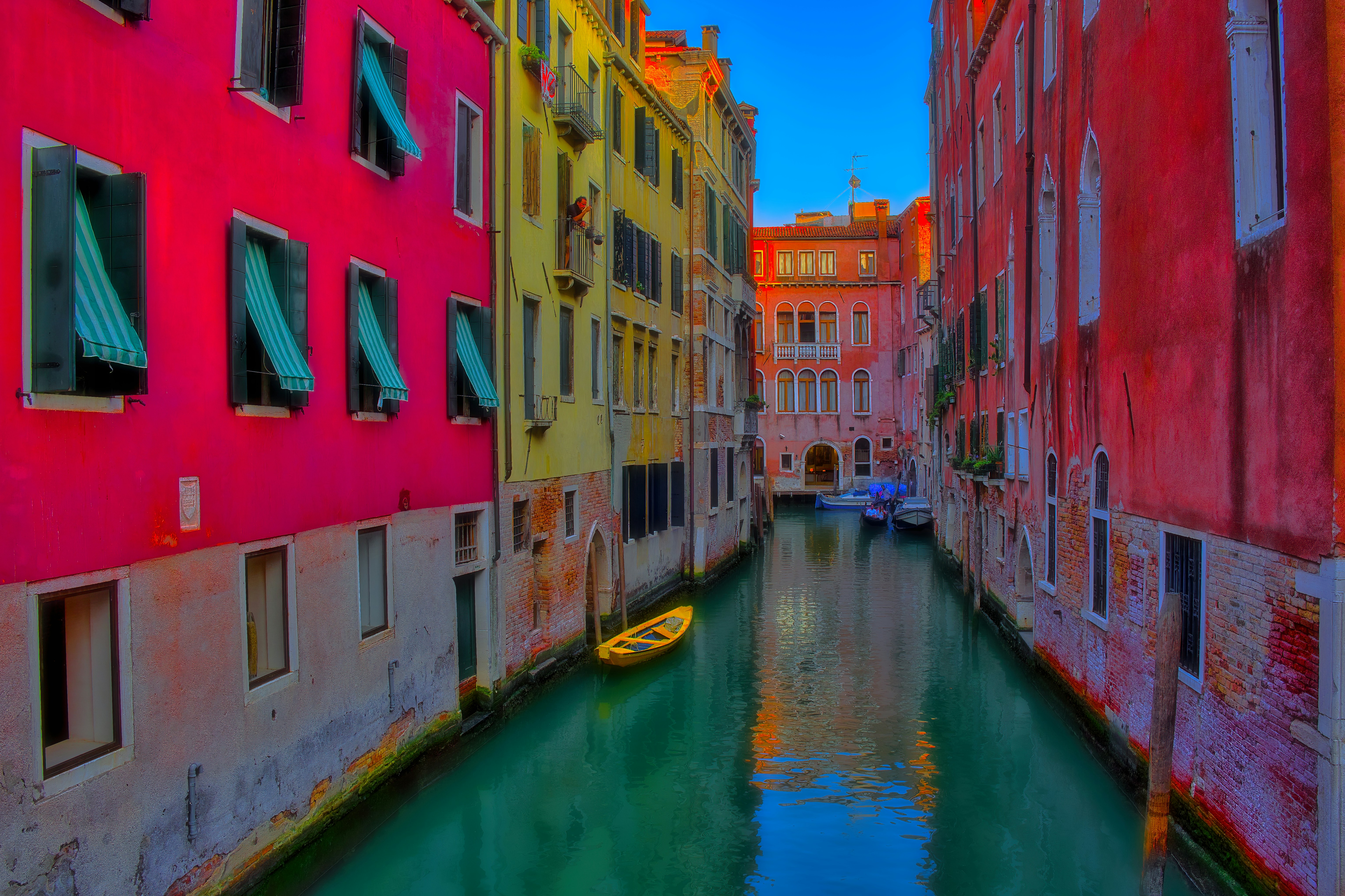 Vivid Canal Veins: A Corridor of Colorful Facades