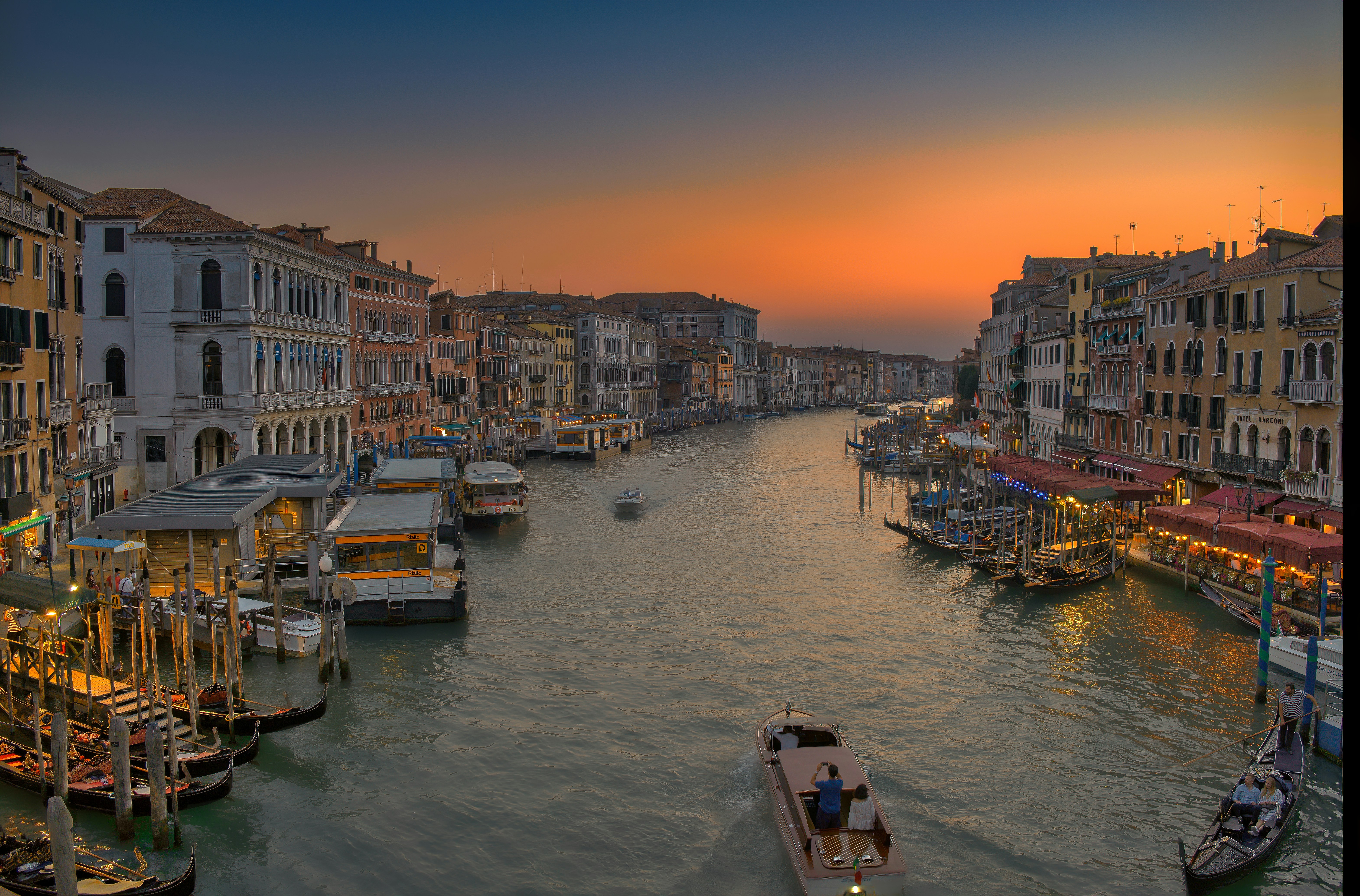 Sunset Over a Venetian-Style Canal: Boats and Historic Facades