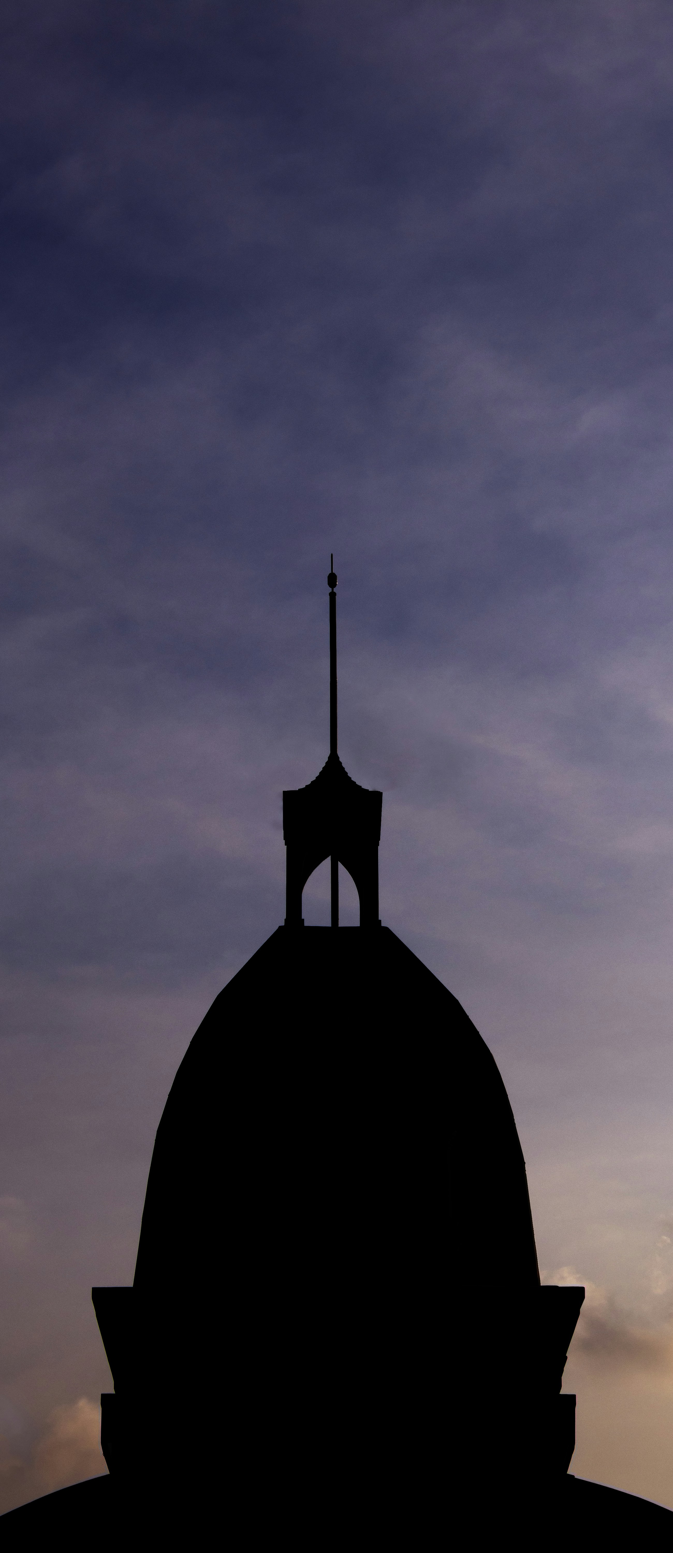 Silhouette of a Domed Spire Reaching Toward a Pastel Sky