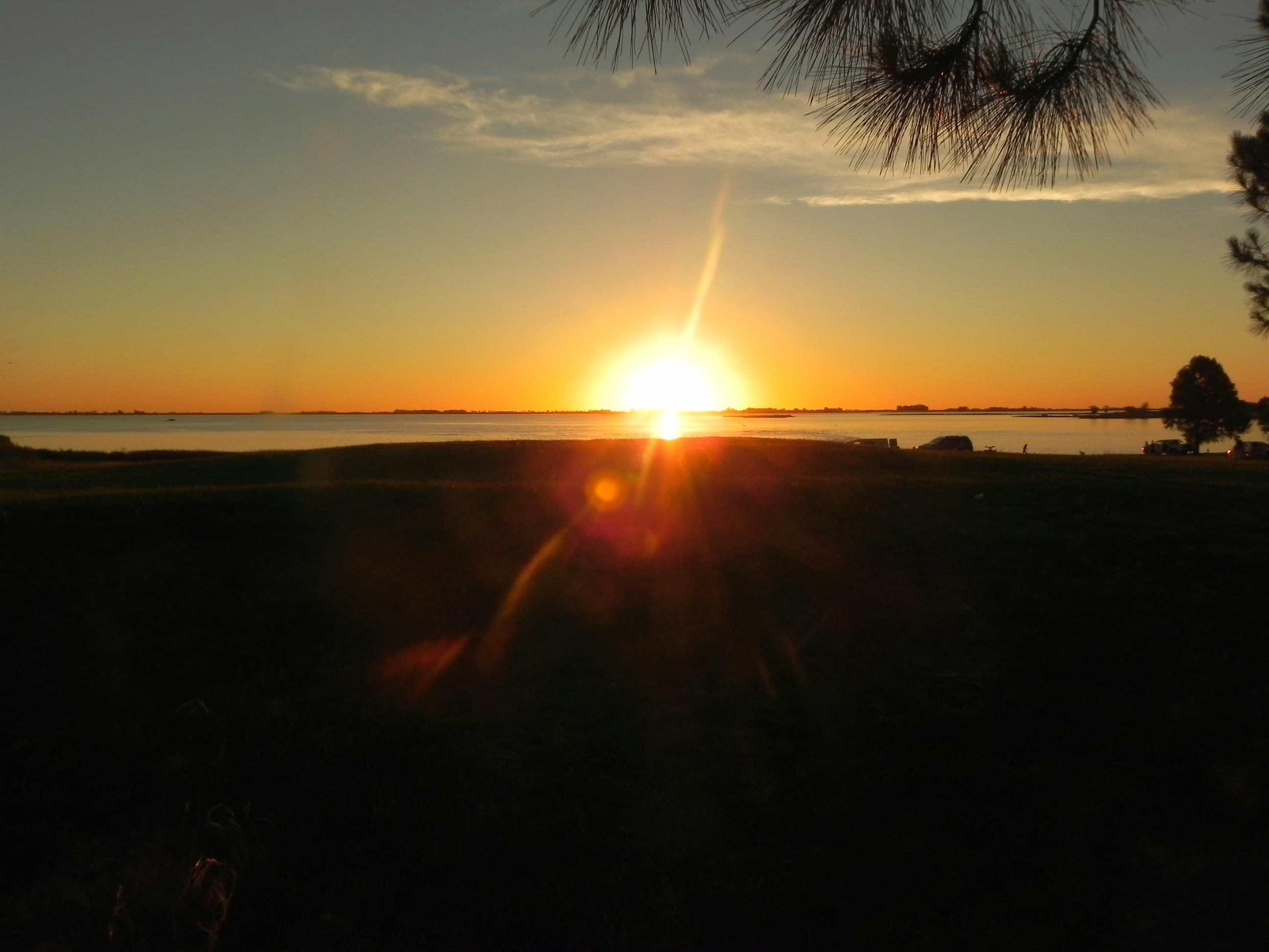 Golden sunset over a calm body of water.