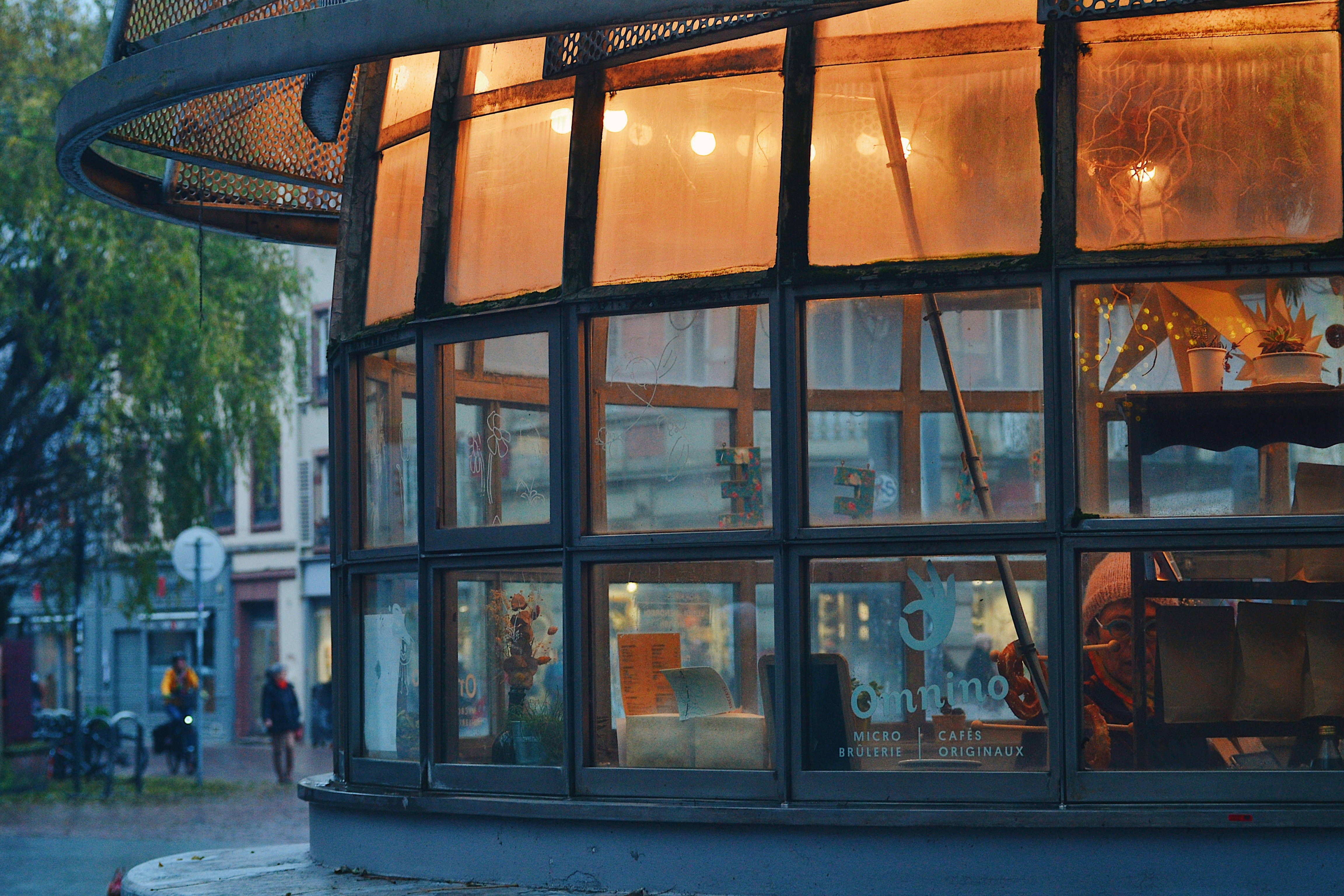 Glow in the Glass: Urban Café Vista at Dusk