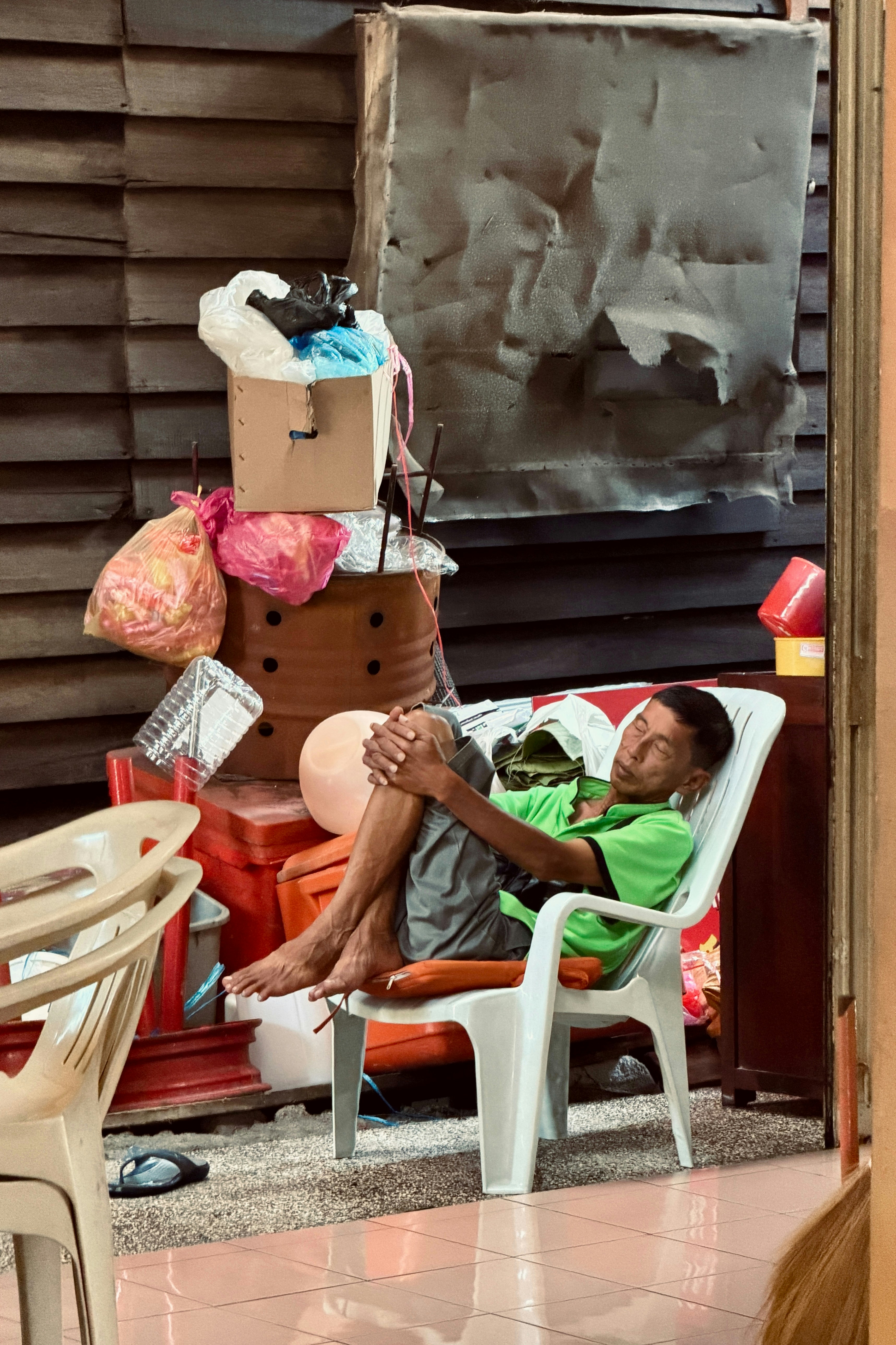 Relaxed Recliner in a Cluttered Laundry Nook