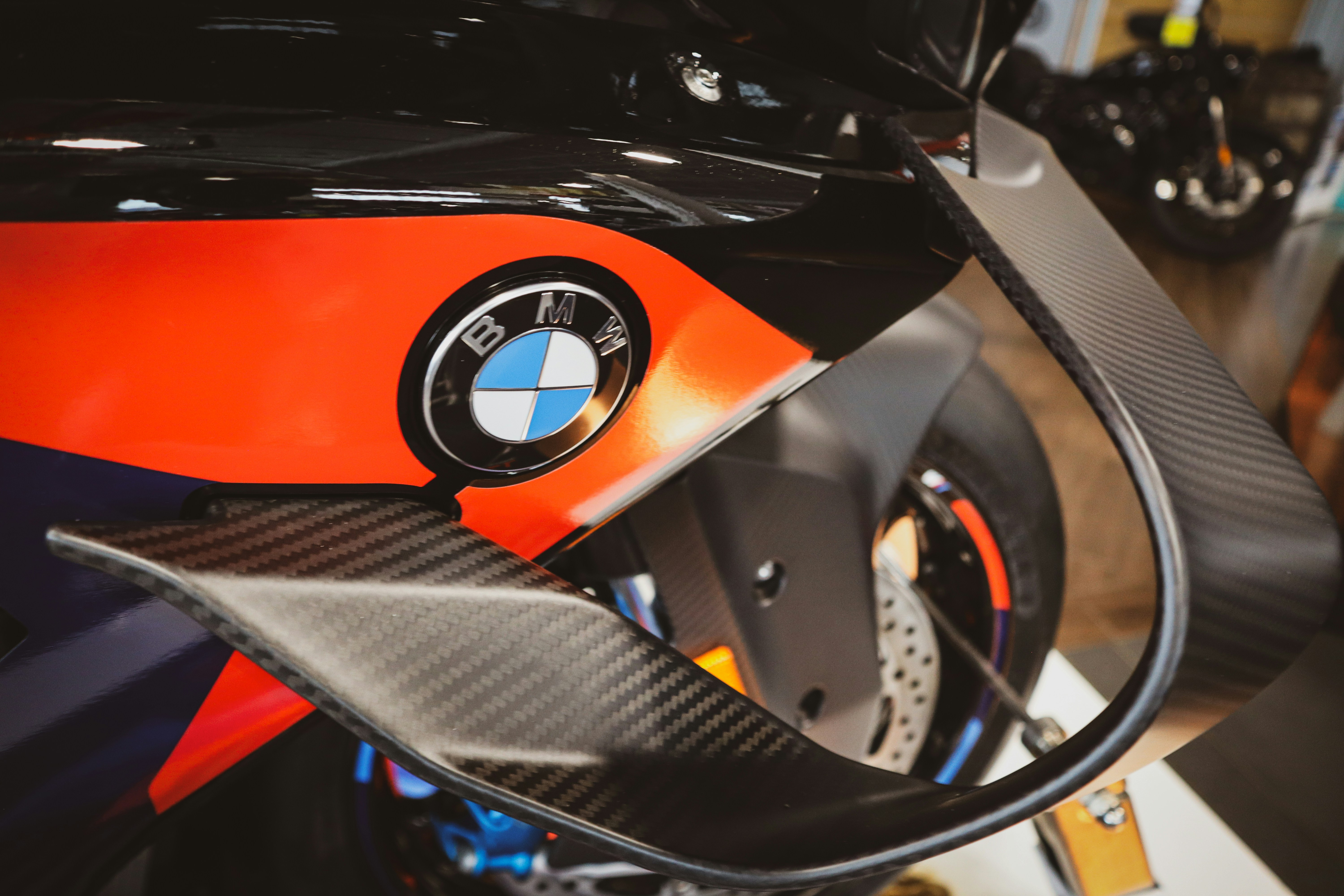 Close-up of a BMW Motorrad race bike's aero cockpit and carbon fiber bodywork
