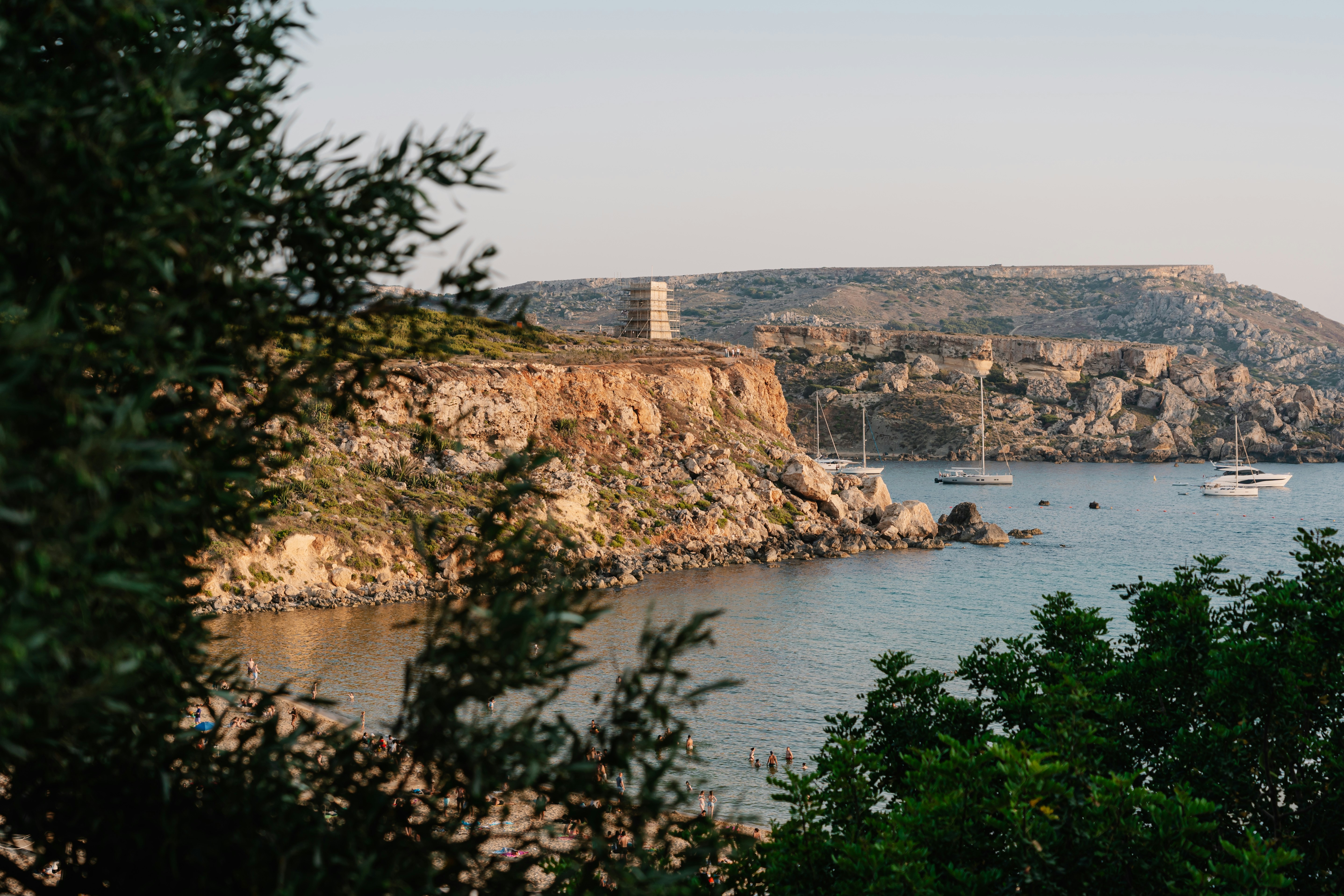 Harbor Cliffs and Quiet Mast at Dusk