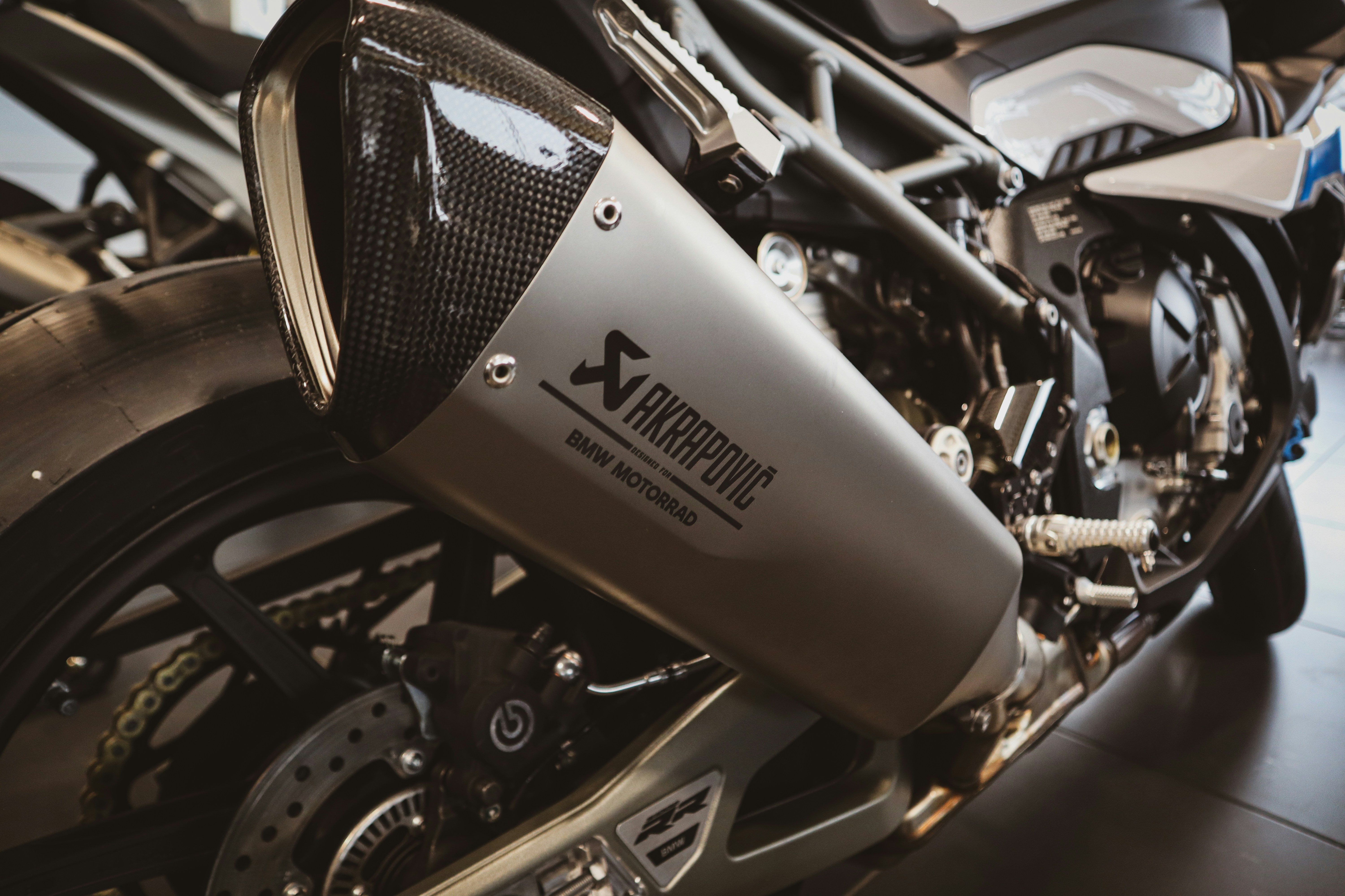 Close-Up of a Raw Exhaust Silencer on a Ducati-styled Motorcycle