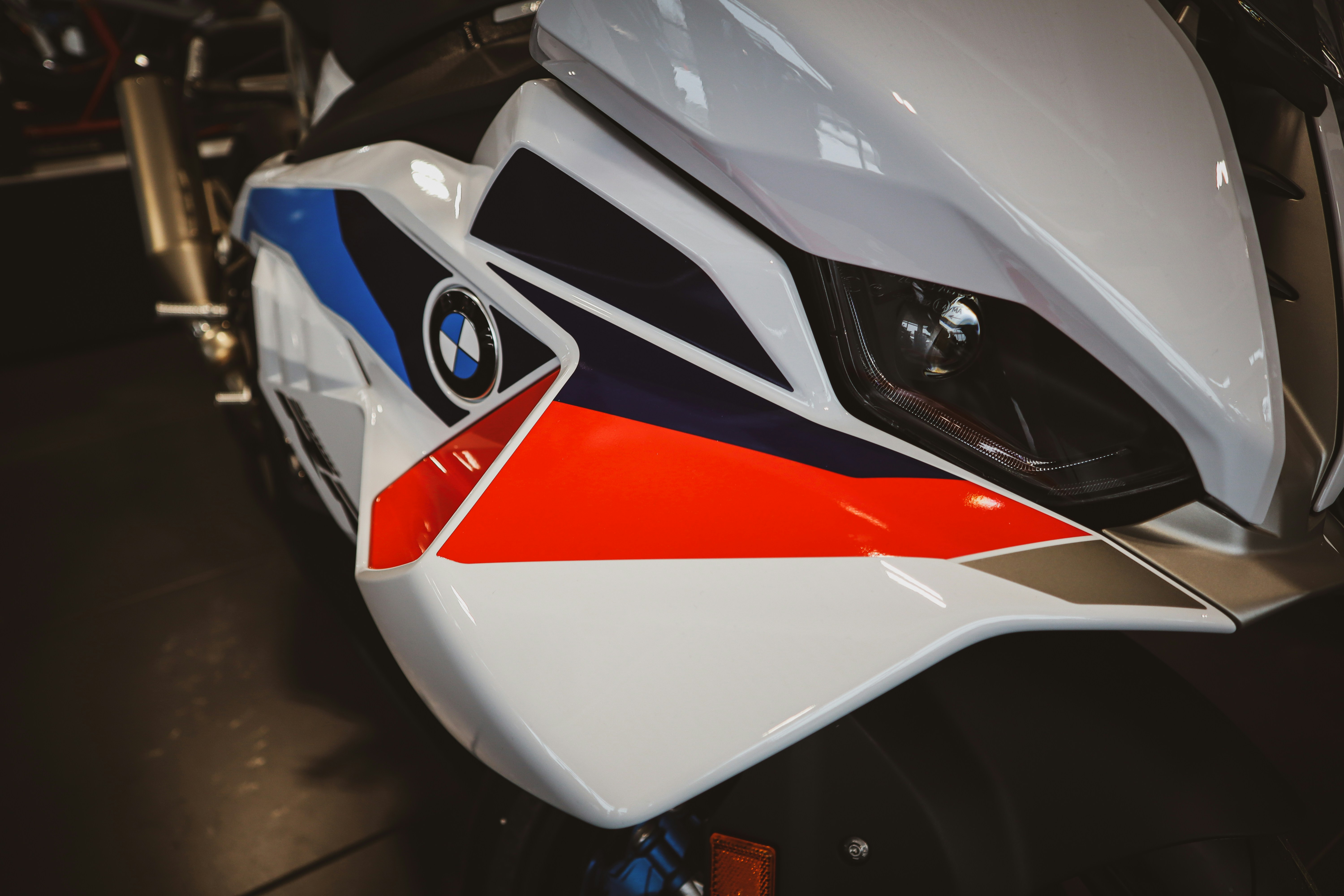 Close-up of a BMW motorcycle fairing with iconic blue-red branding