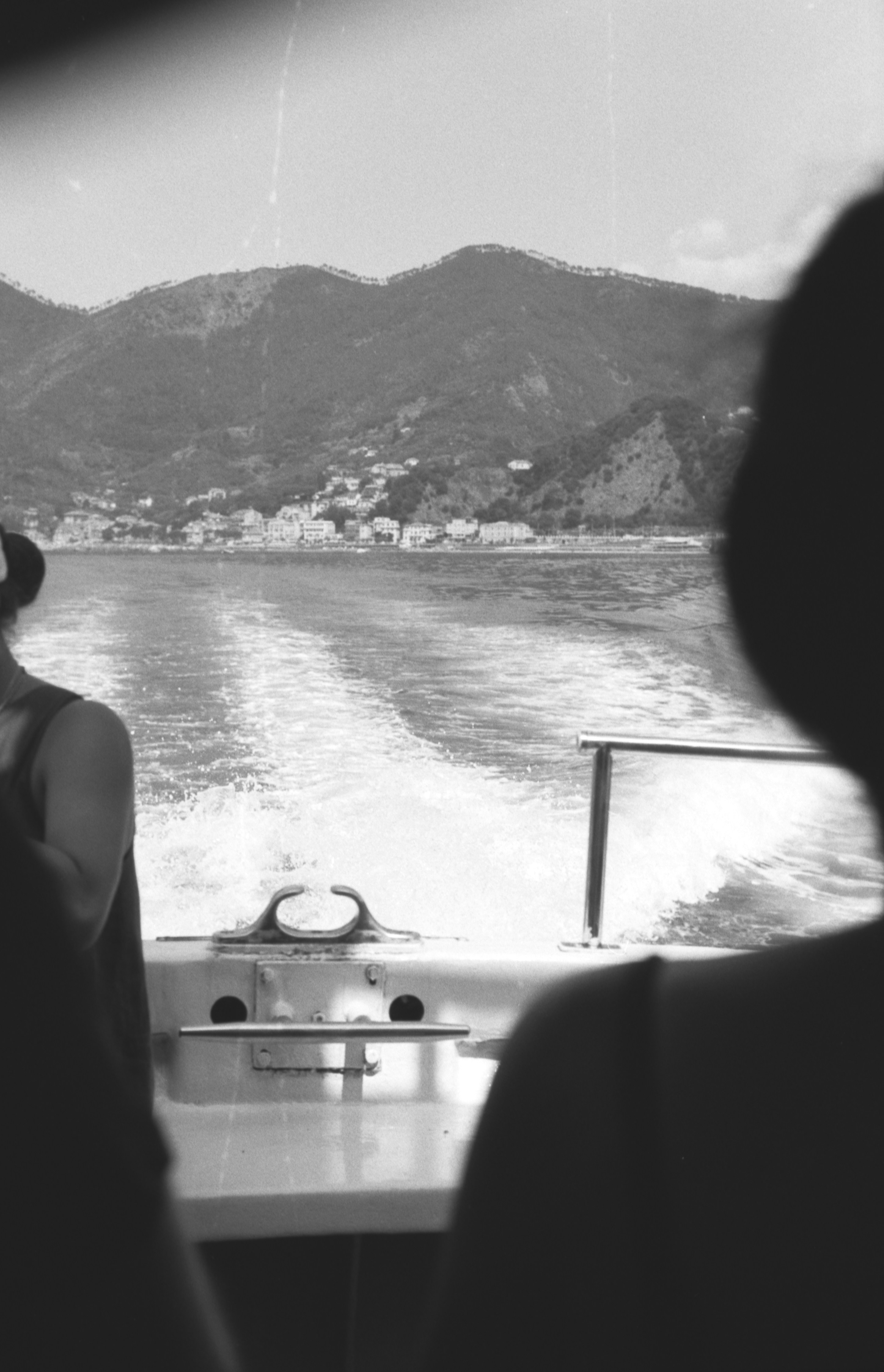 Wake of the Wake: Foredeck View across Coastal Town