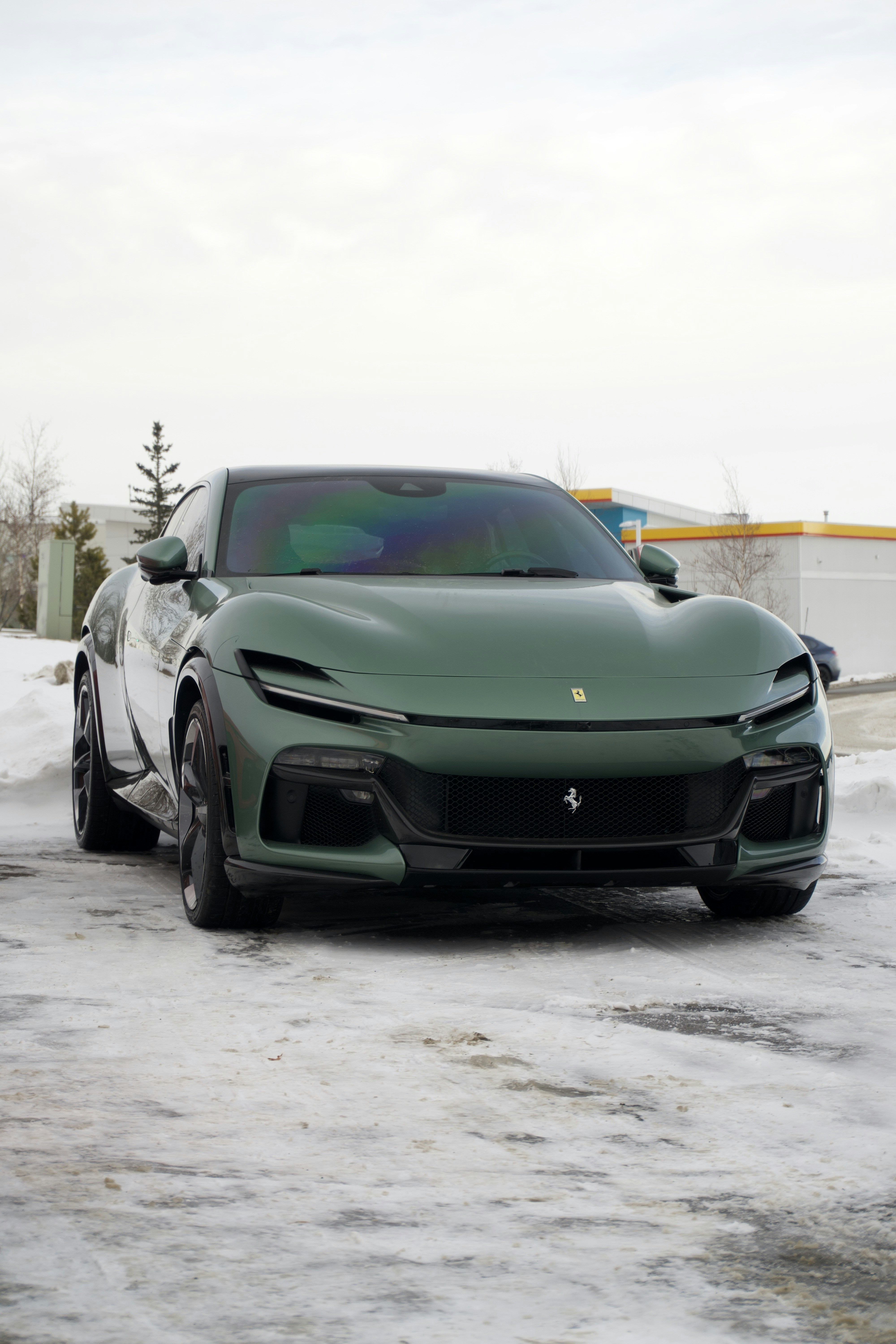 Green Ferrari Stance: Power Meets Winter Pavement