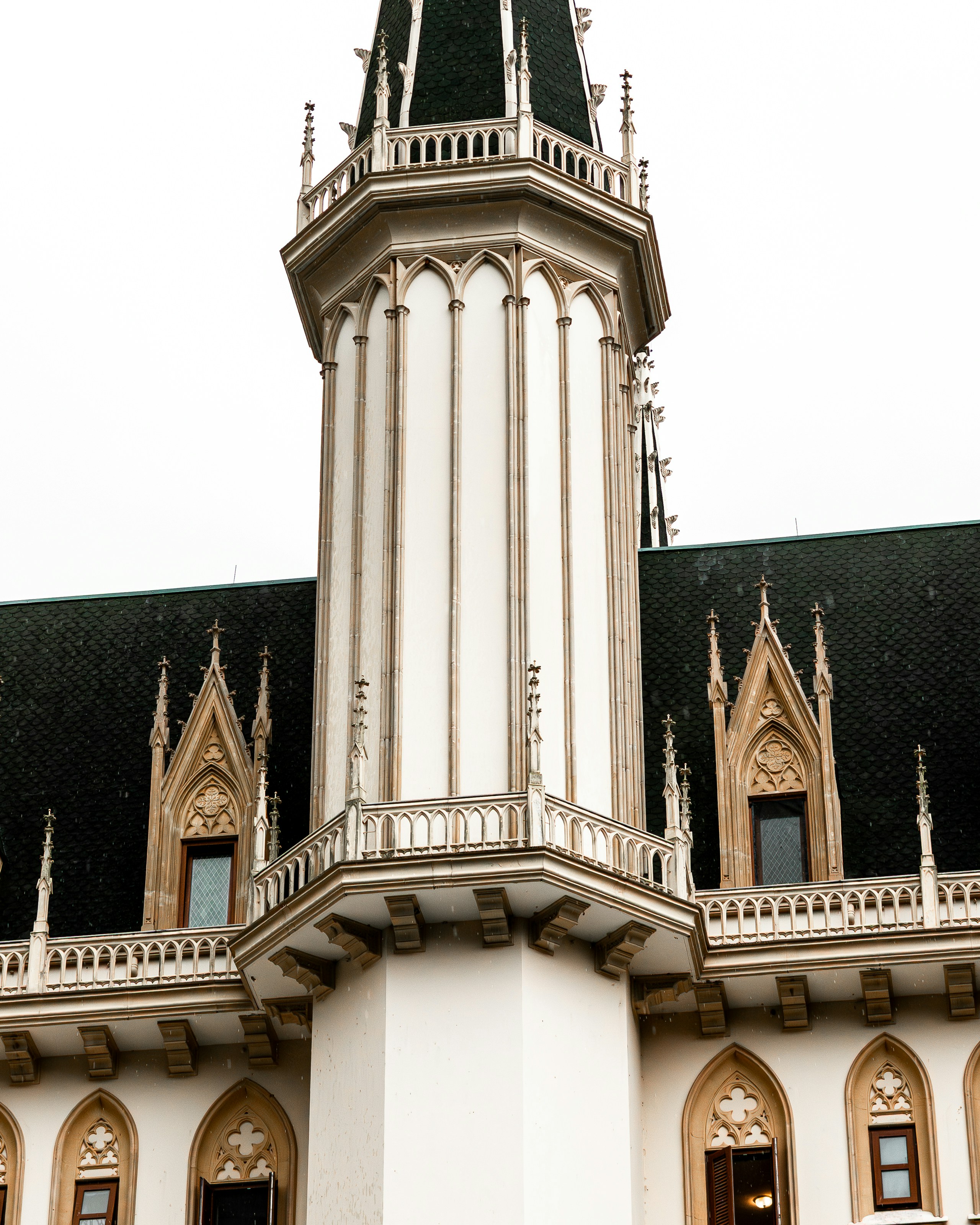 Ornate Clocktower Empress: Gothic Detailing Rising Above the Parapets