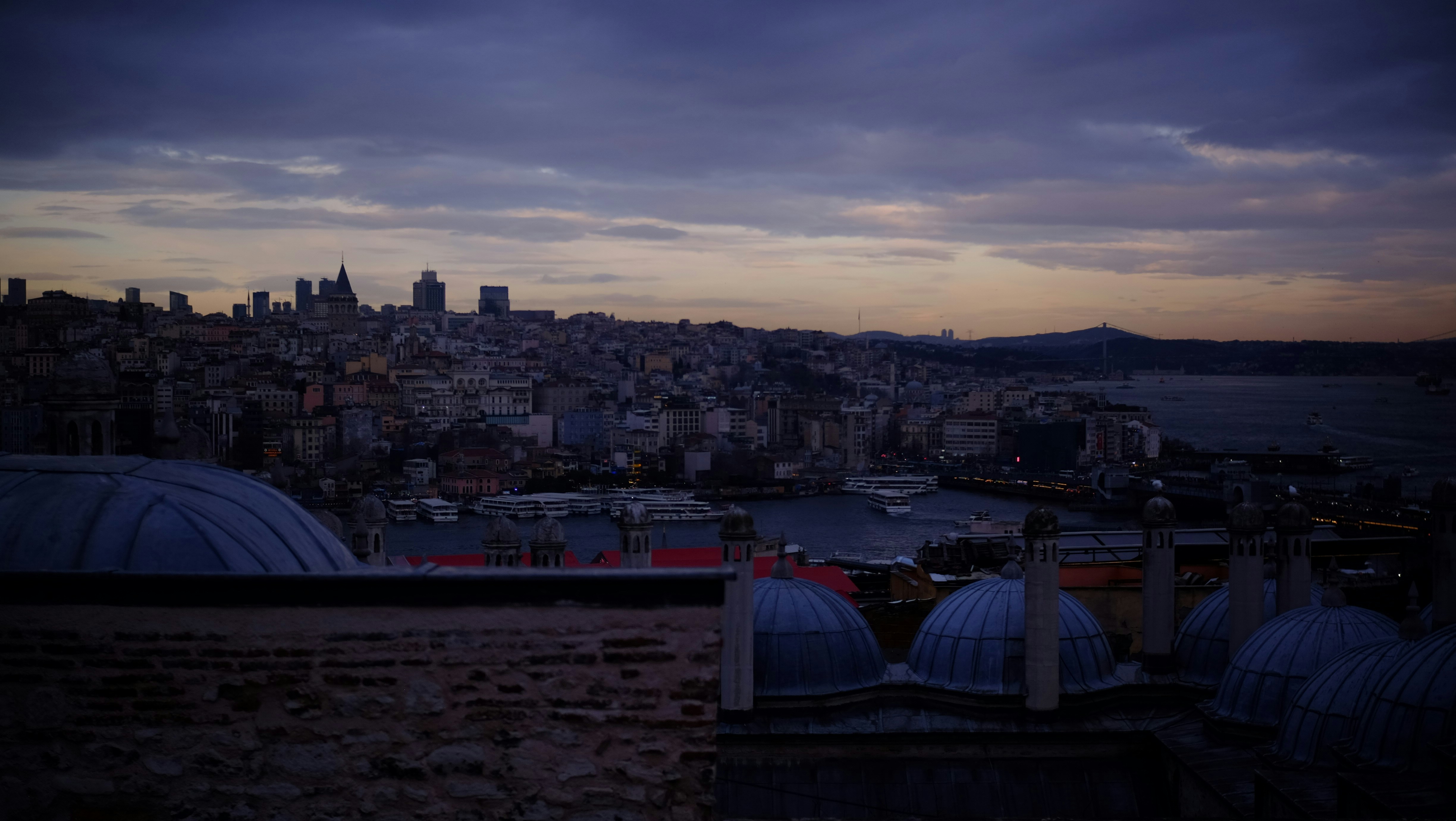 Dusk Over the Quiet Harbor: Rooftops and silhouettes Between Sky and Water