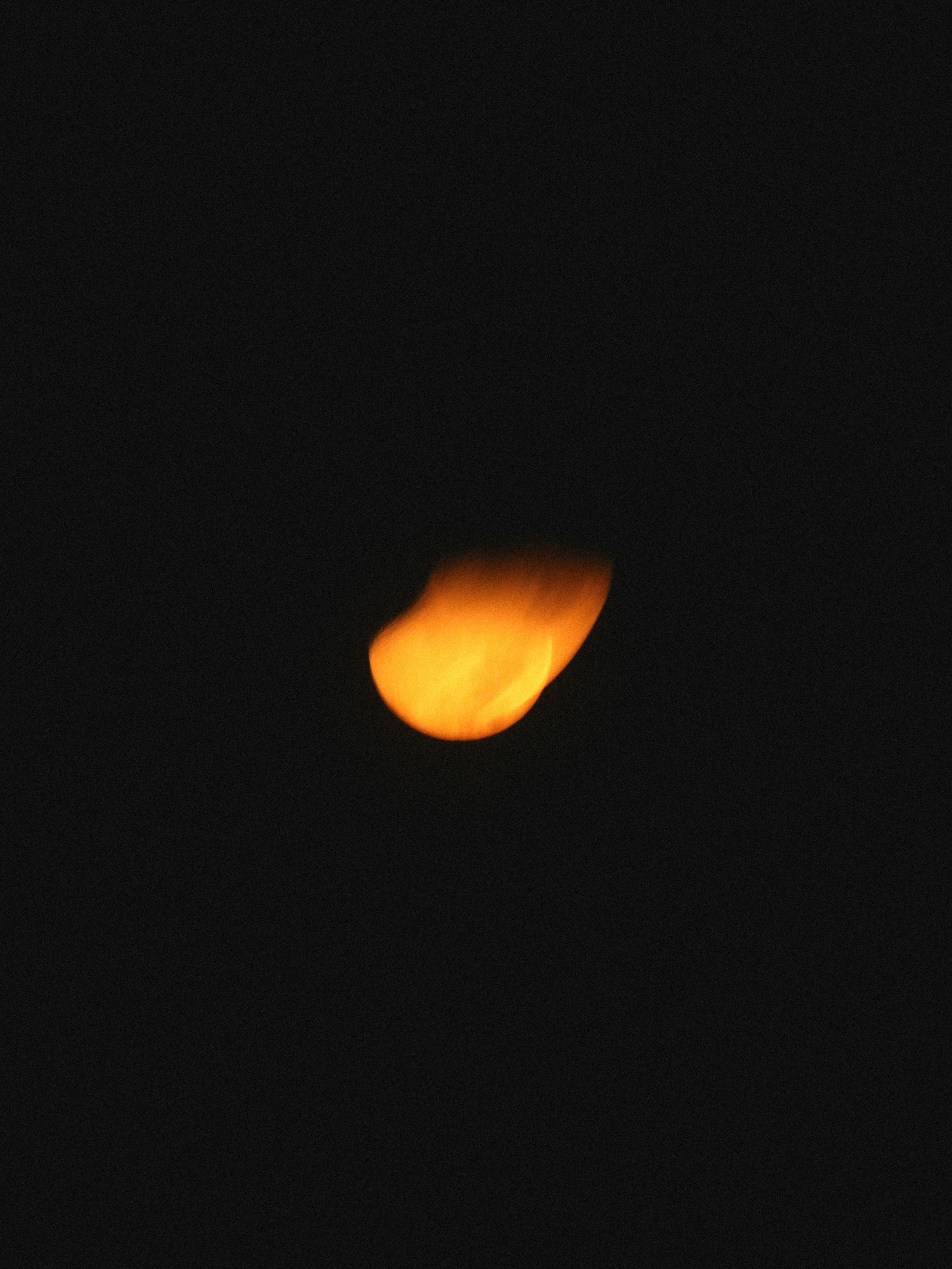 Lunar Ember: A Moonlit Crescent in Quiet Black