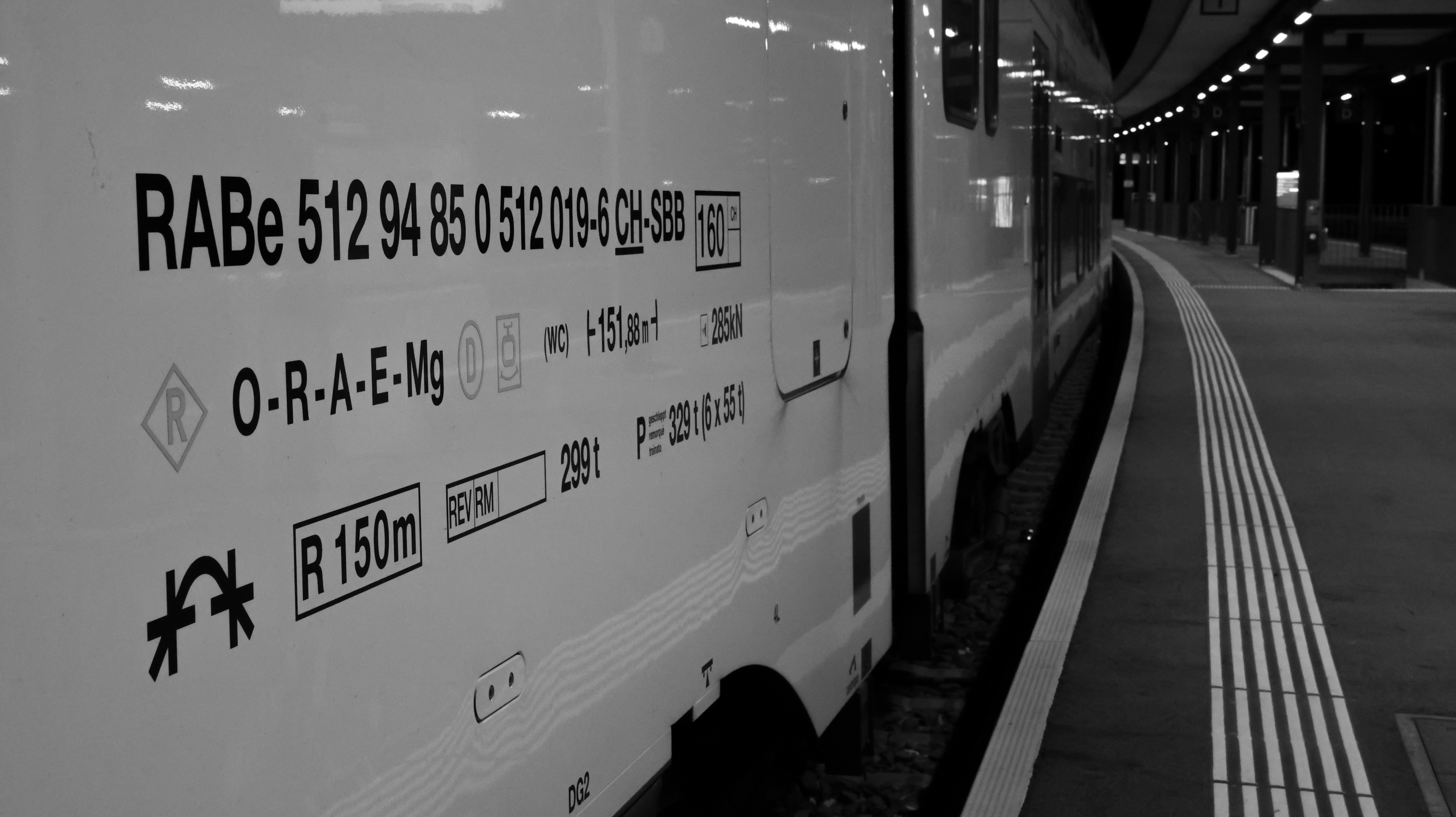 Whistle-stop at a Quiet Platform: Train Car Details in Monochrome