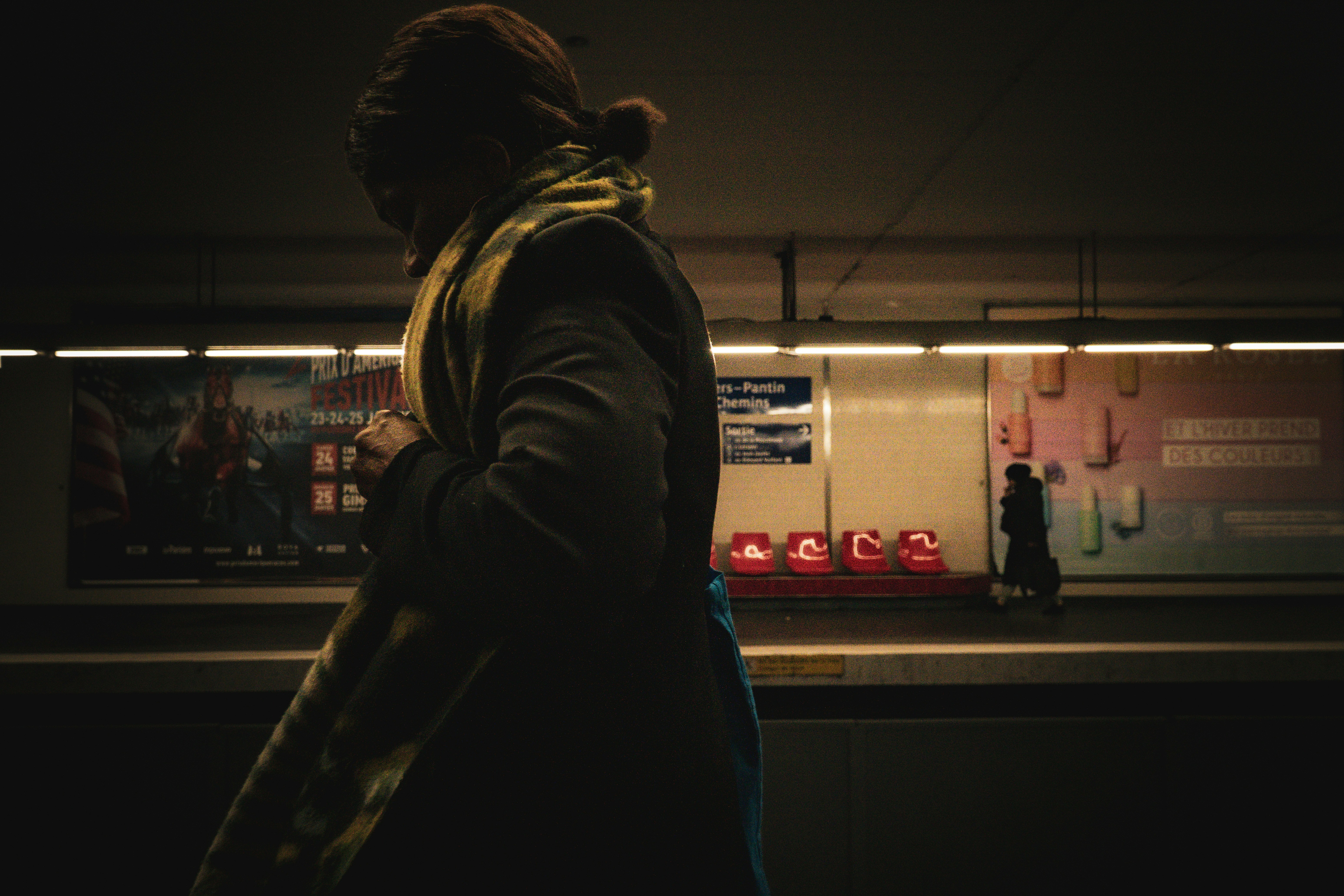 In the Neon Quiet: A Subway Moment in Low Light