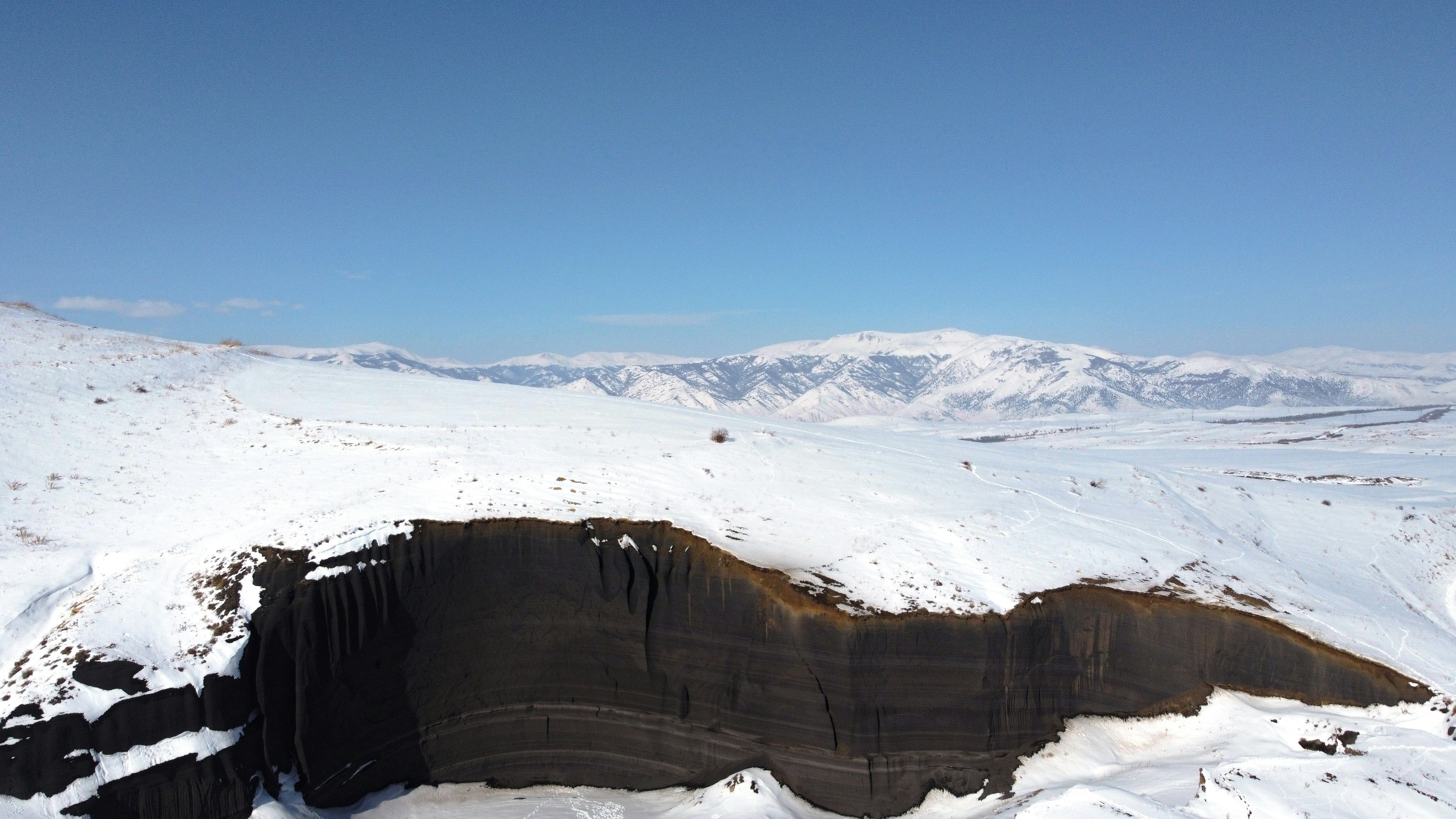 Snowbound Lips of Dark Canyon under a Clear Hull of Sky